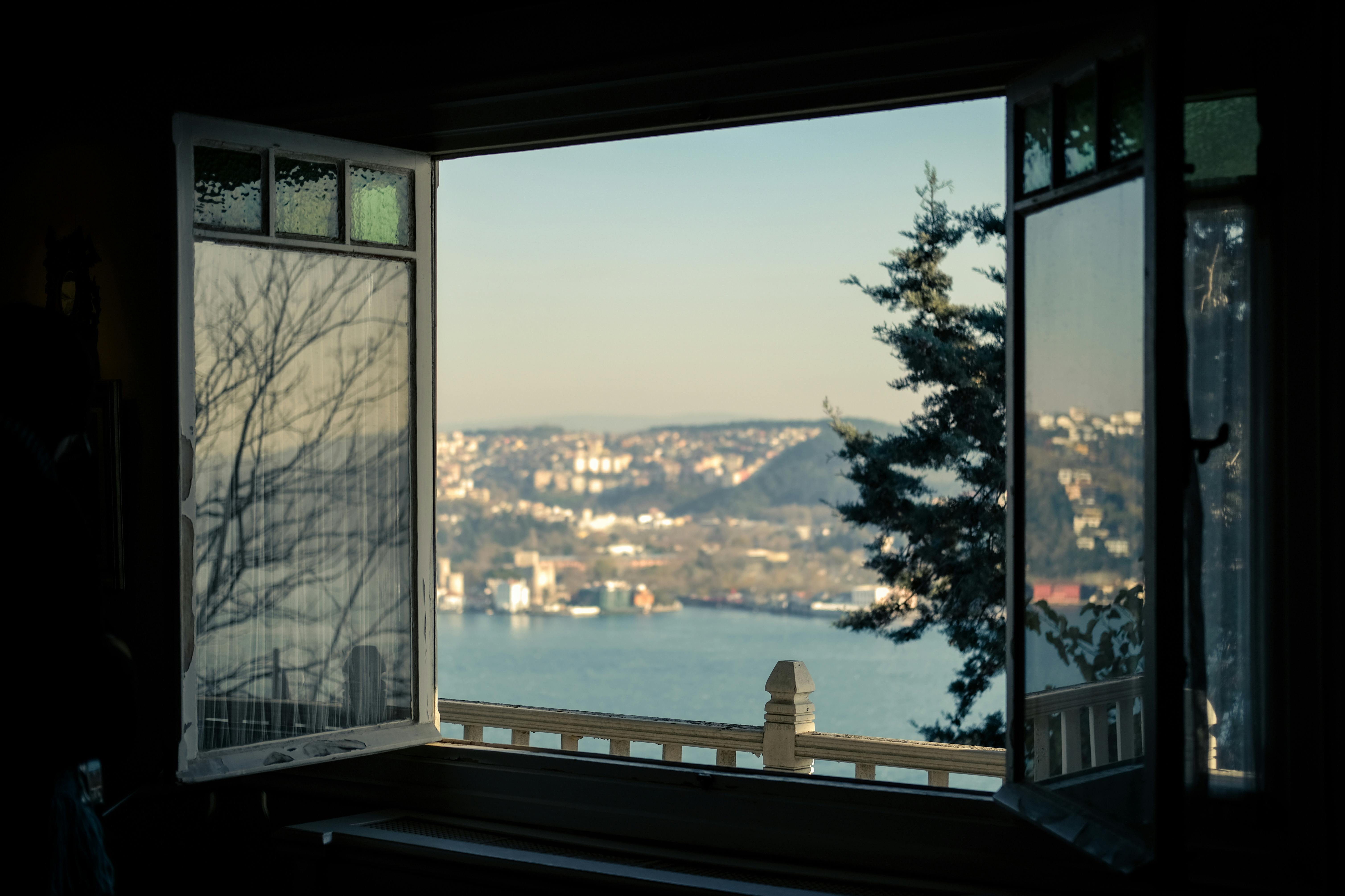 View of a Body of Water and City from a Window on a High Floor · Free ...