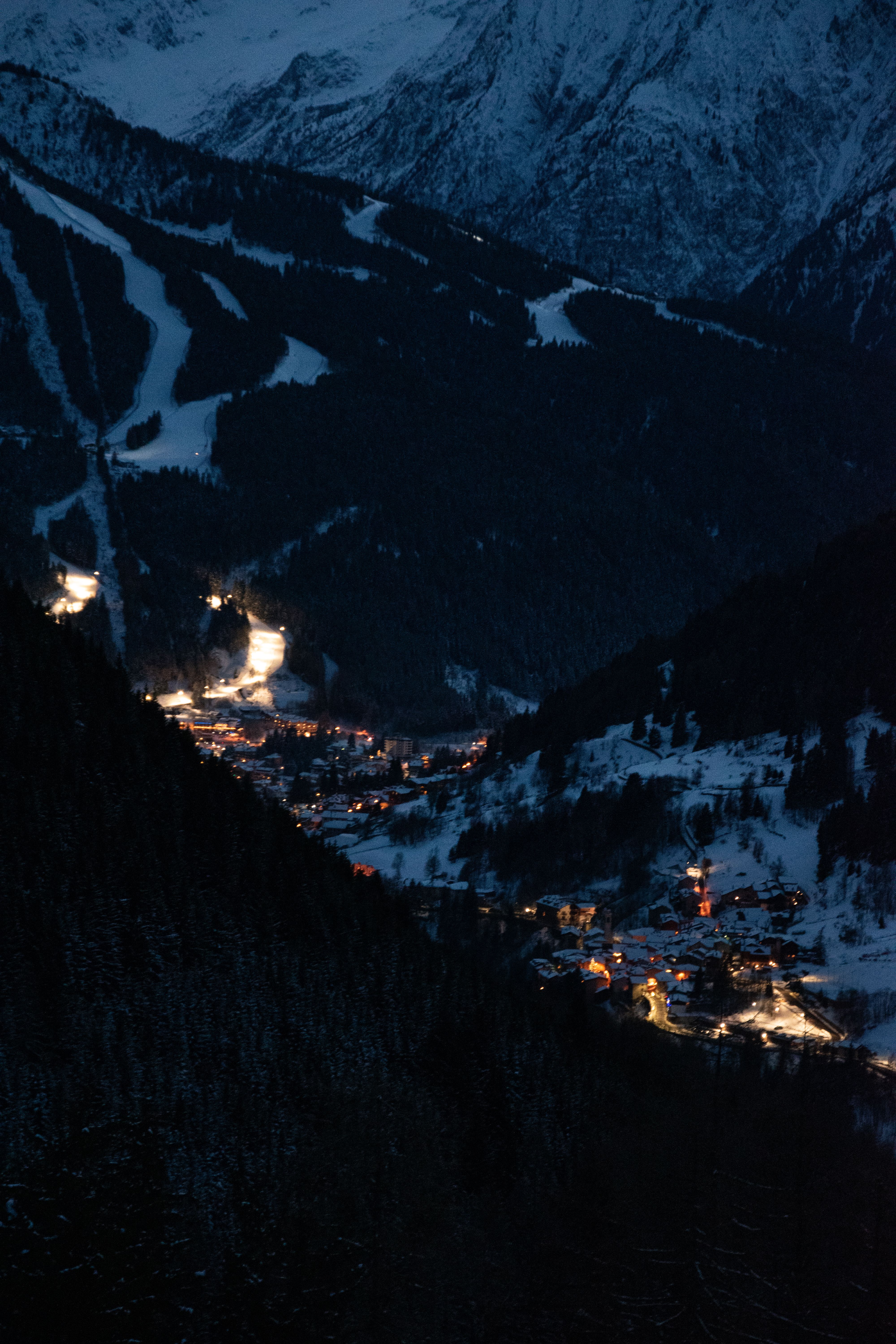Aerial View of Illuminated Buildings in a Mountain Valley Village ...