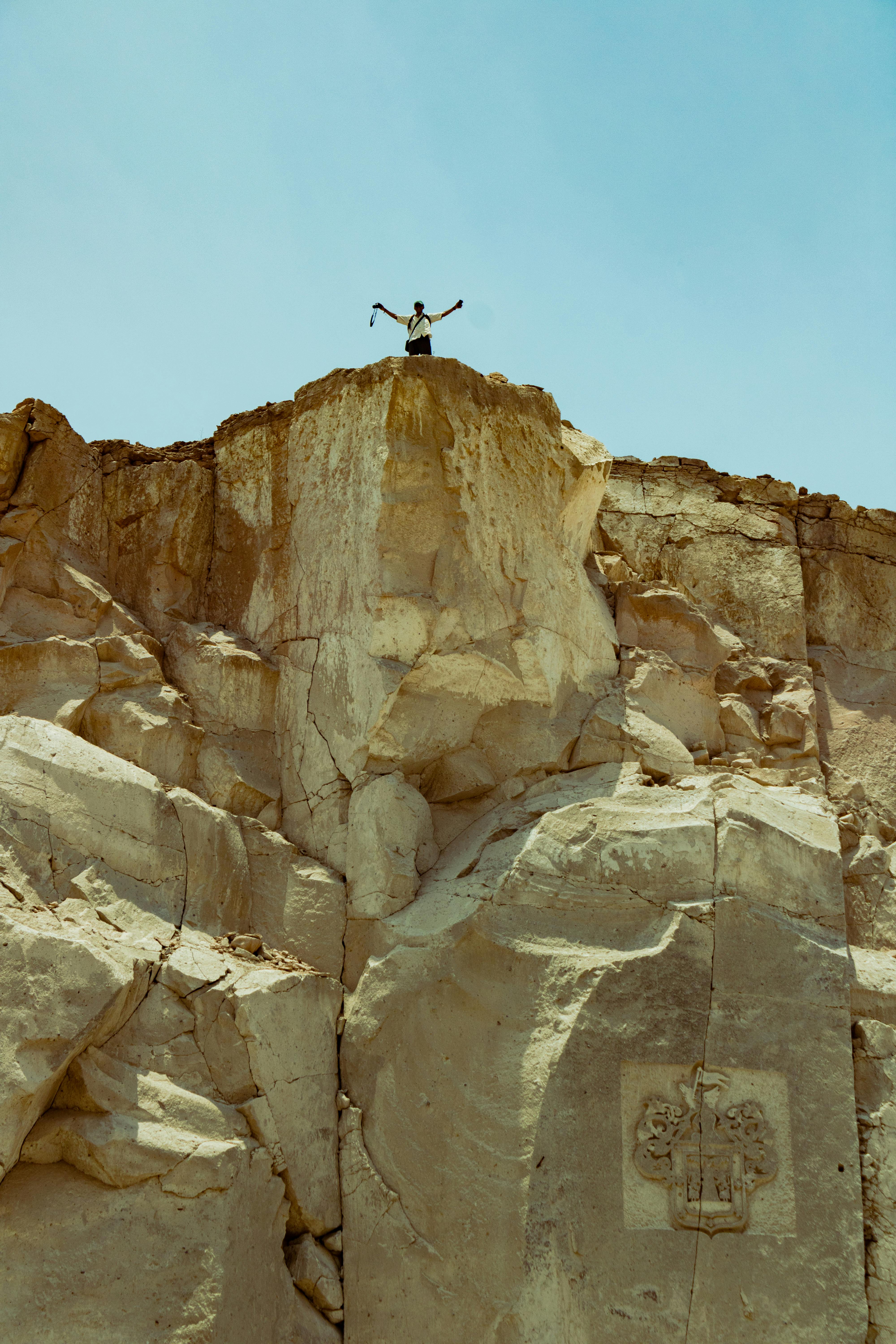 Person Standing on Rocks over Abyss · Free Stock Photo