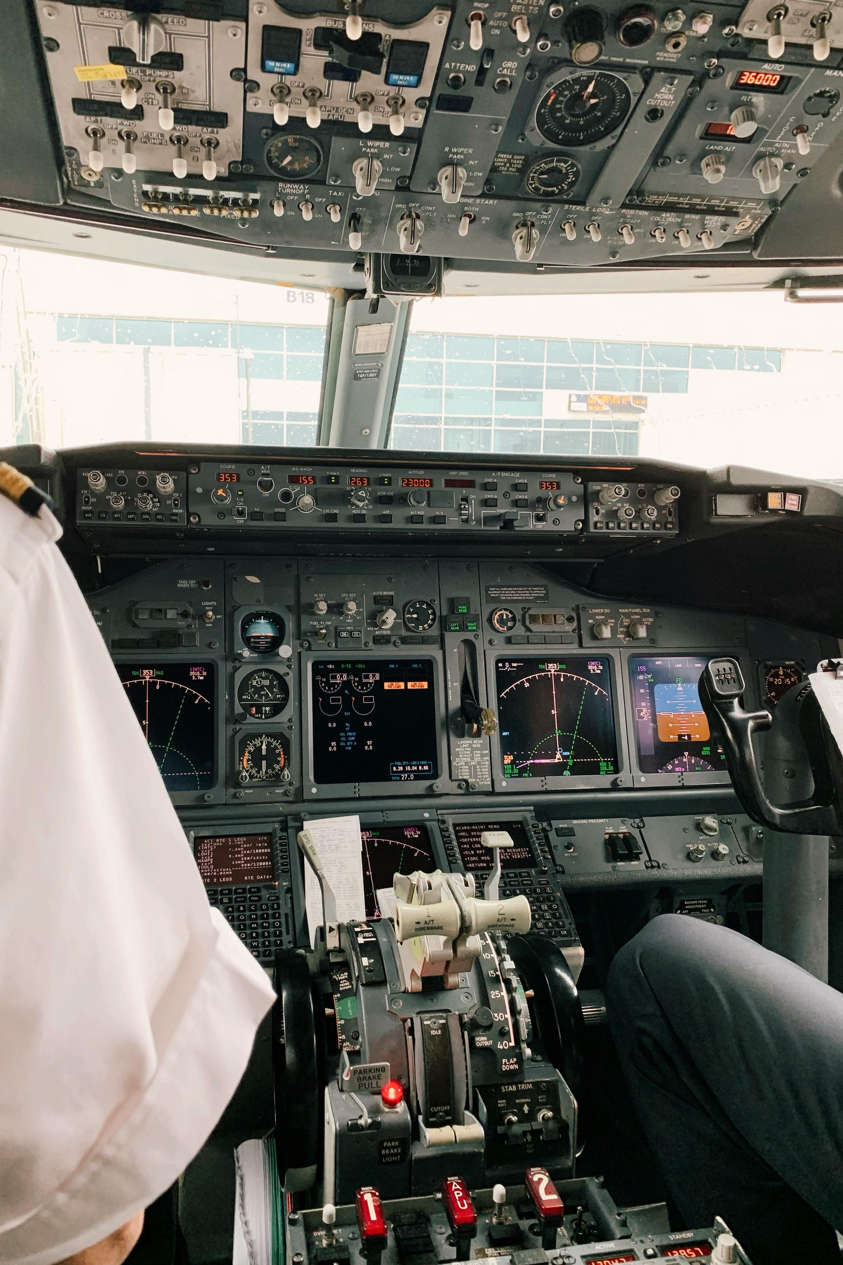 Man Sitting Inside a Cockpit of an Airplane · Free Stock Photo