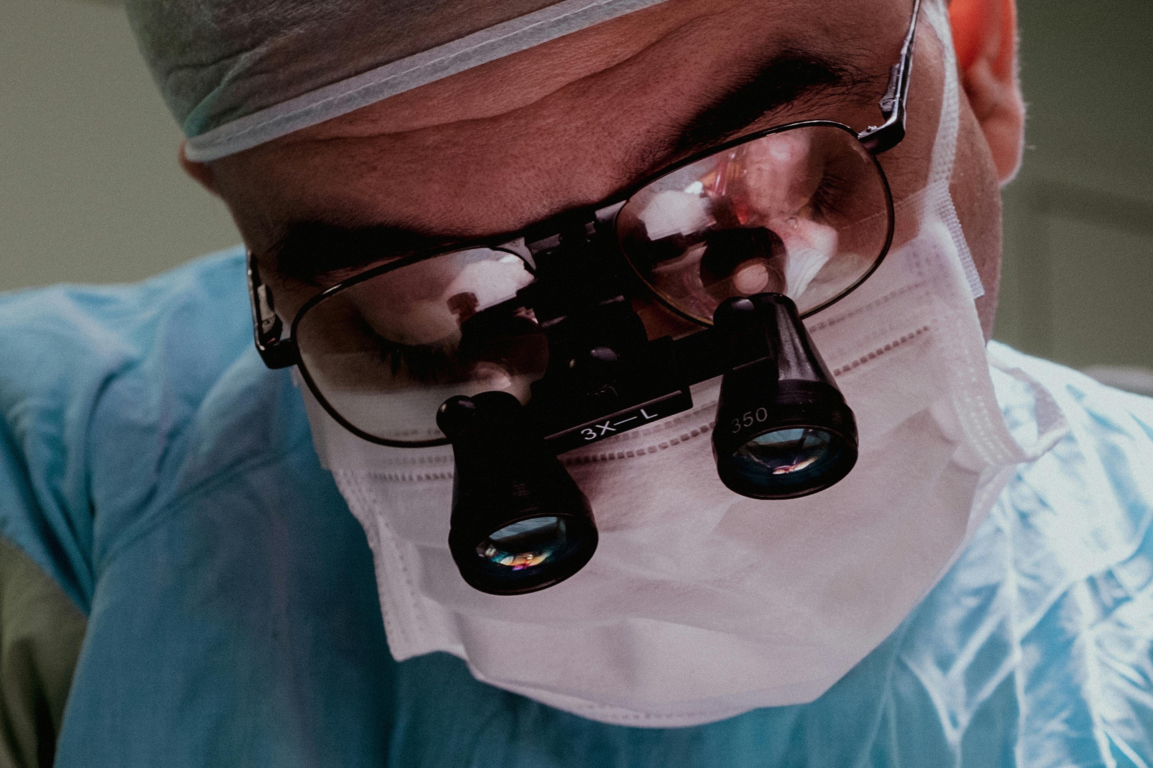 Male Surgeon Wearing Surgical Loupes · Free Stock Photo