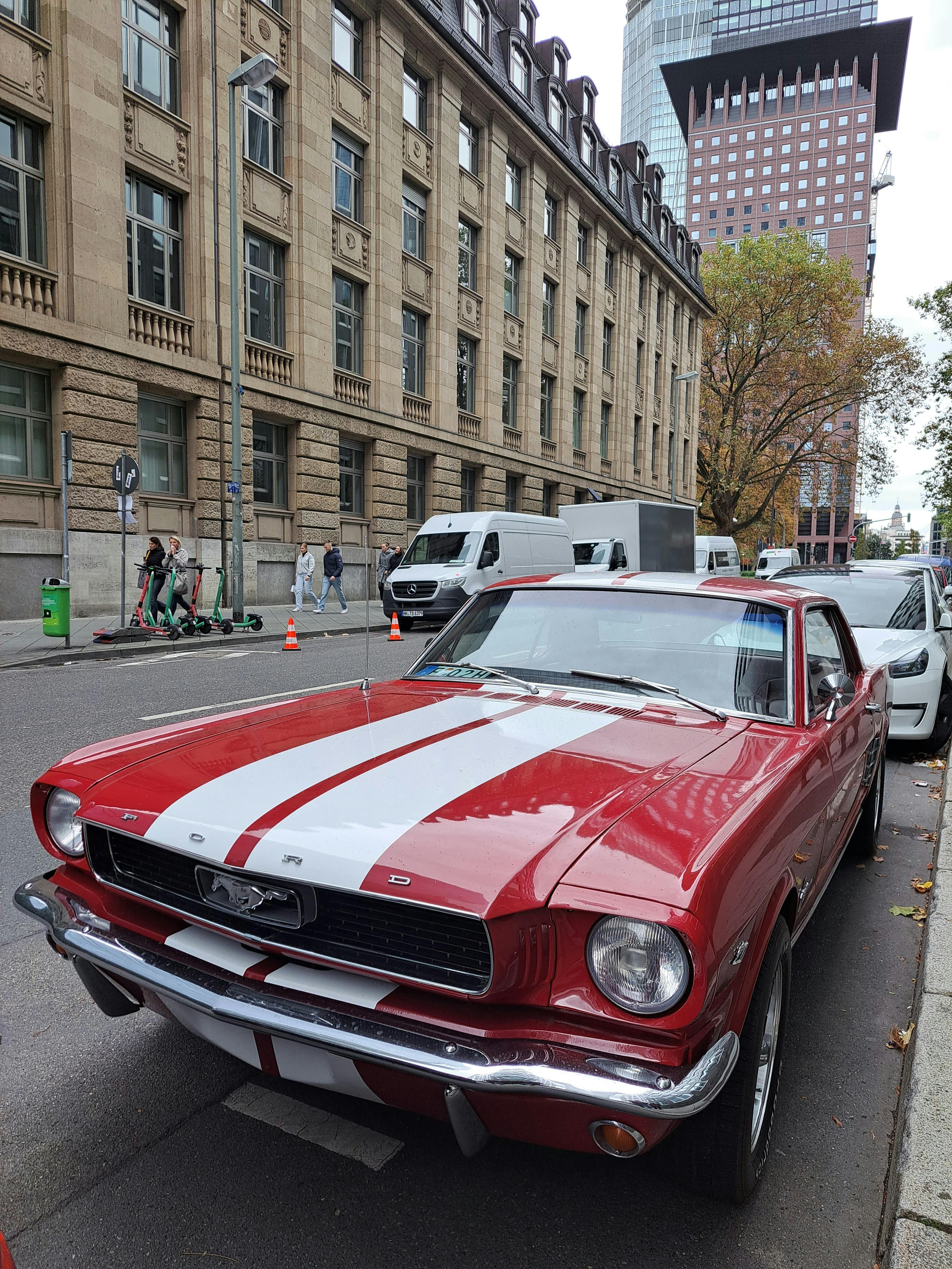 Red Ford Mustang Parked along a City Street · Free Stock Photo