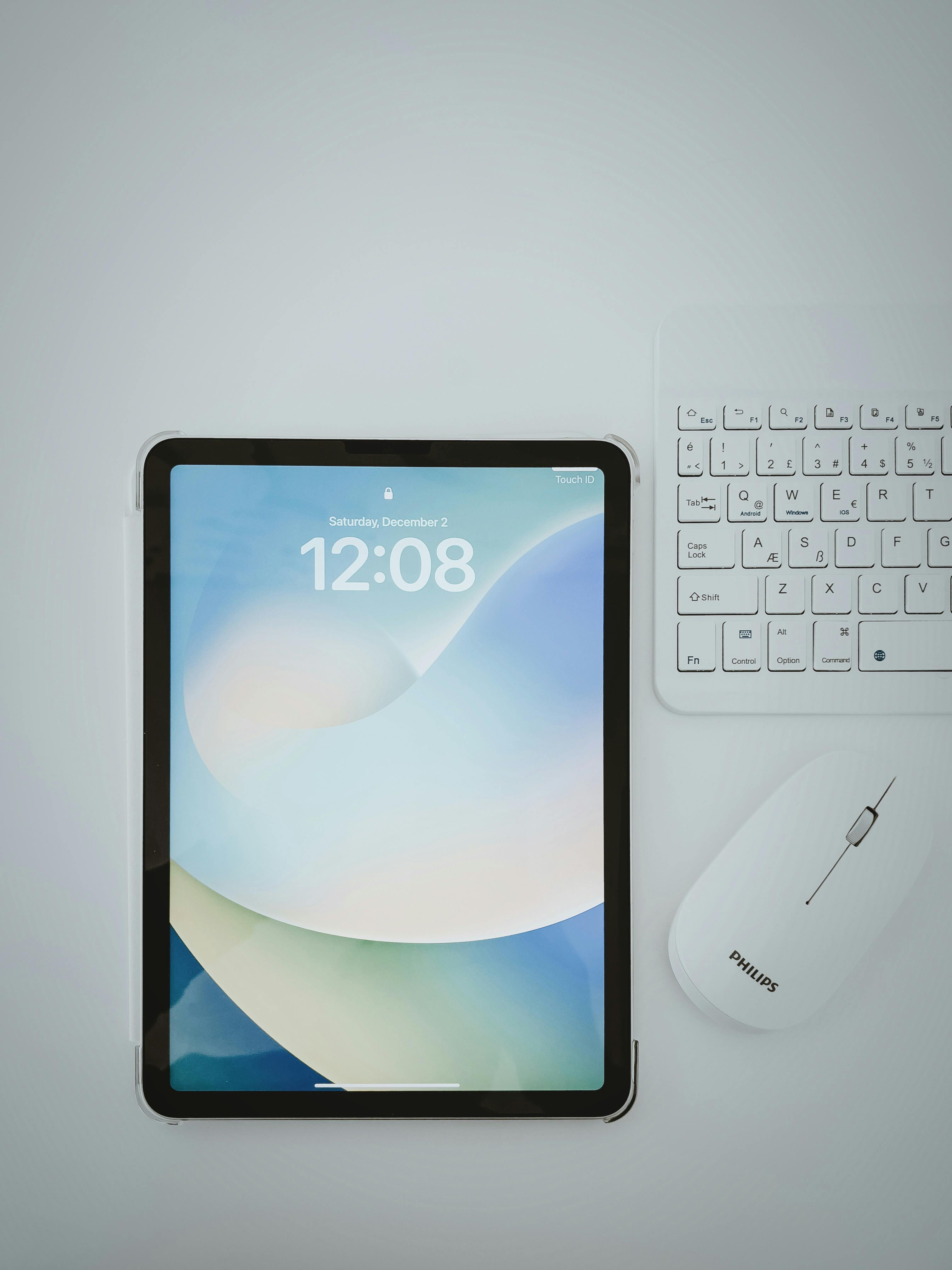 A Tablet, Computer Mouse and Keyboard Lying on a White Surface · Free ...