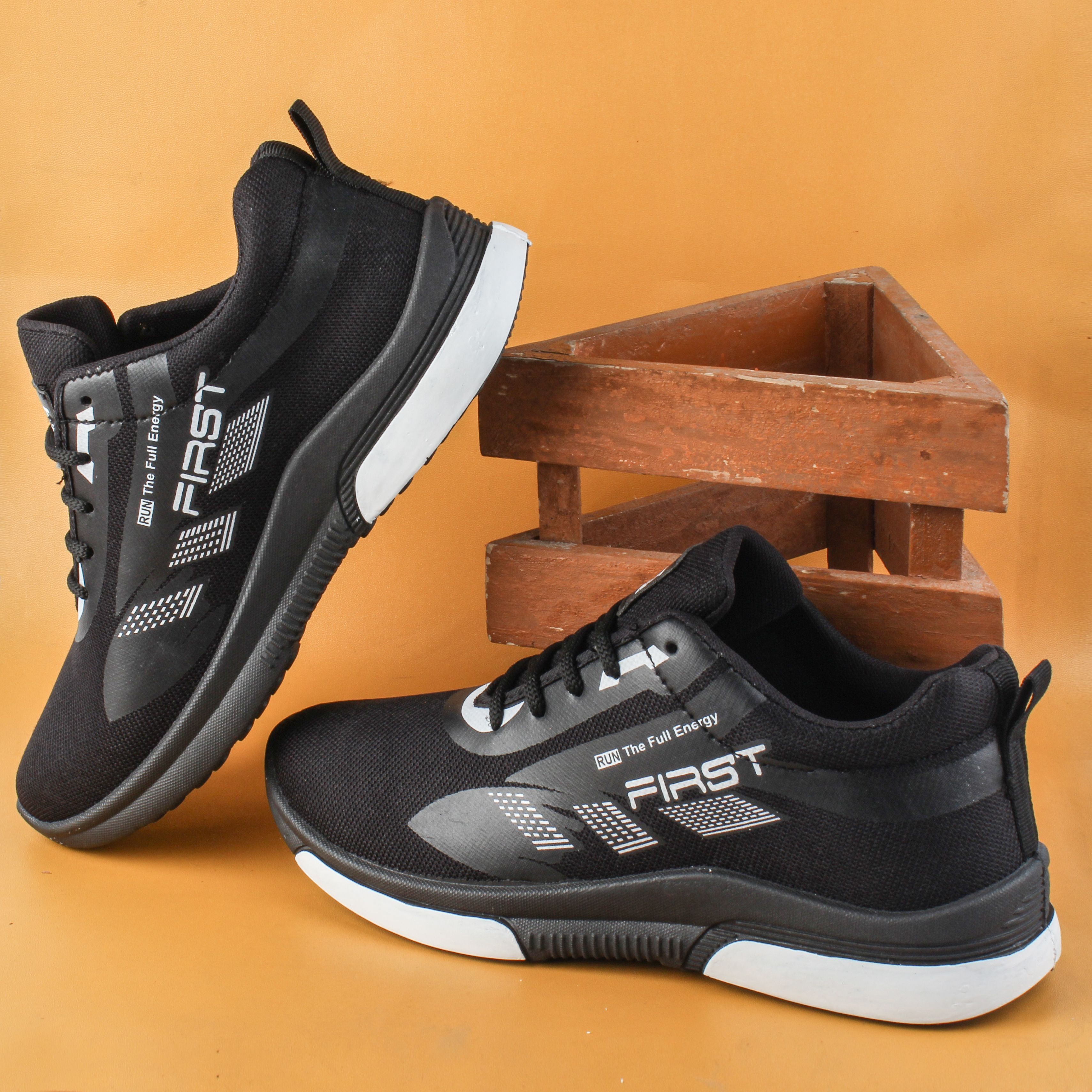 Studio Shot of a Pair of Black Sports Shoes · Free Stock Photo