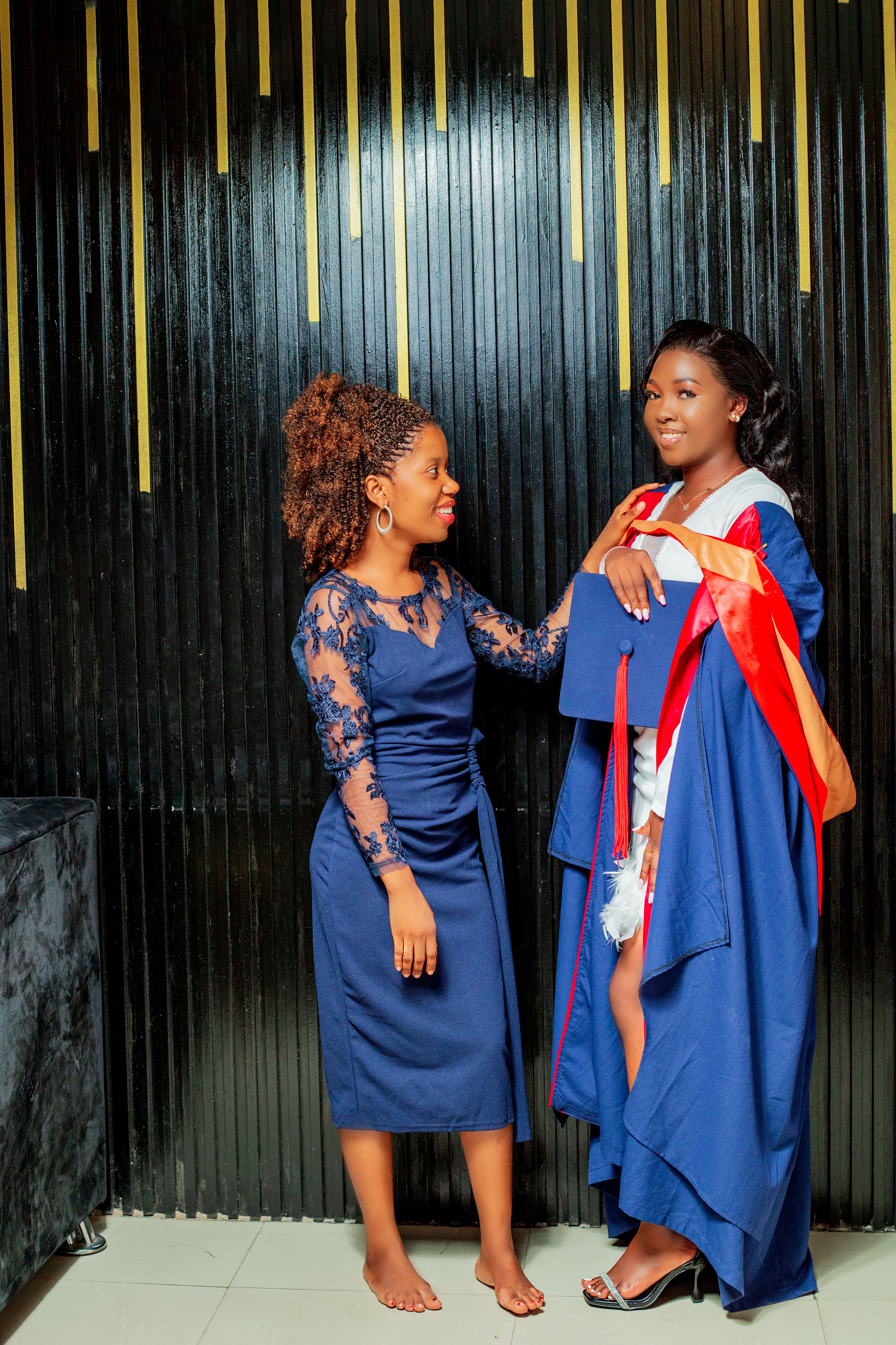 Woman in Blue Dress by Woman in Graduation Gown · Free Stock Photo