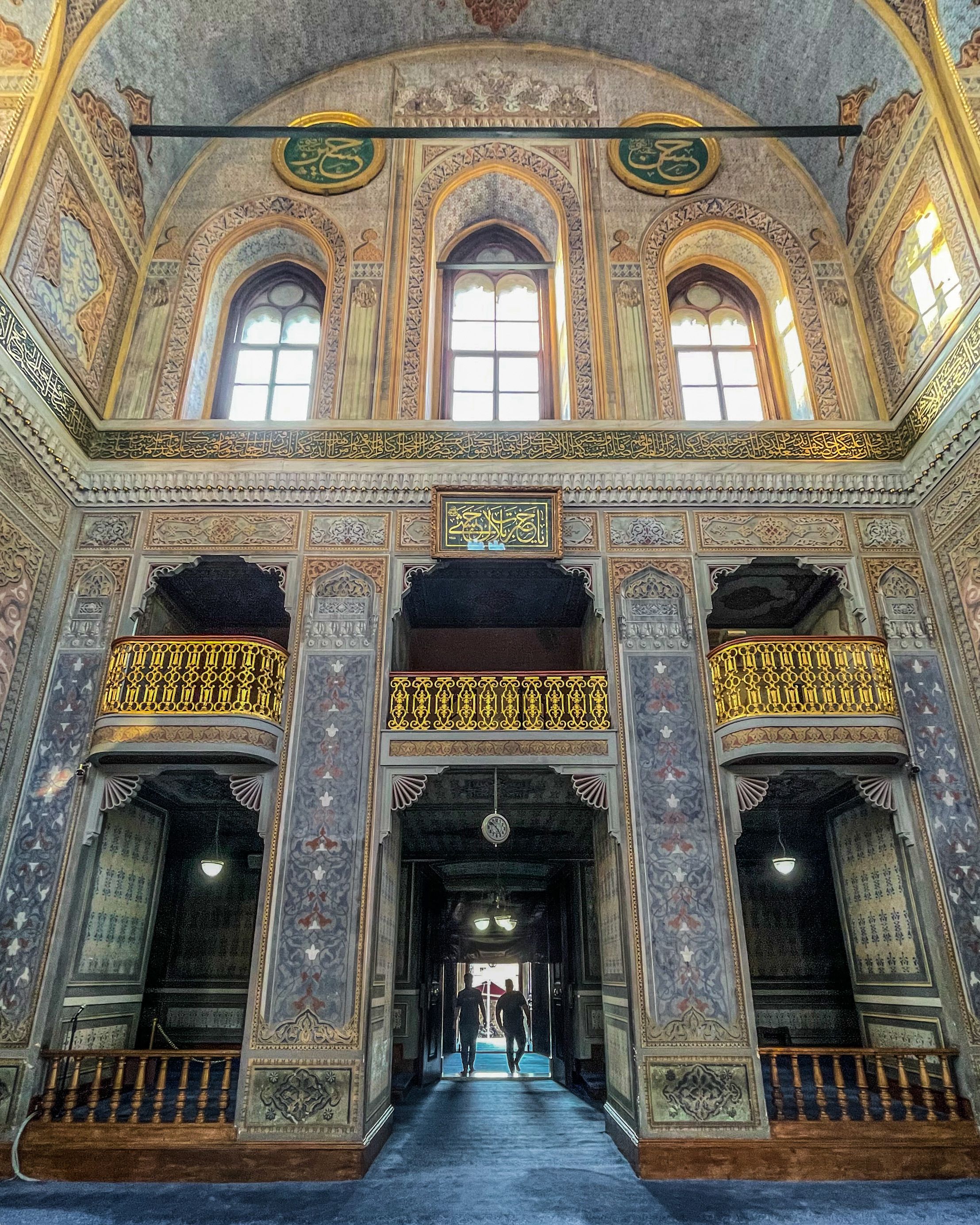 The interior of a building with ornate ceilings · Free Stock Photo