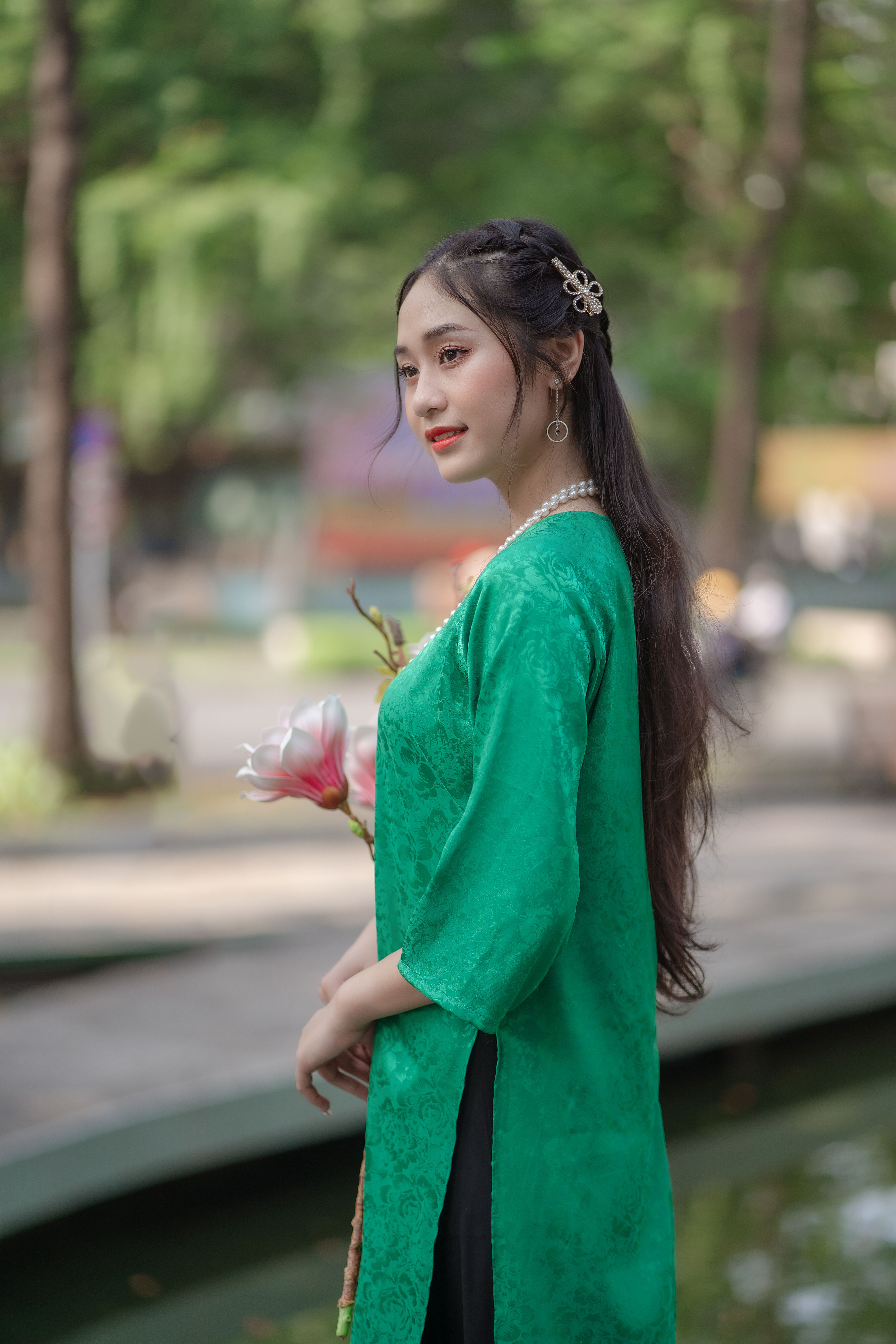 Model Posing in Emerald Dress · Free Stock Photo