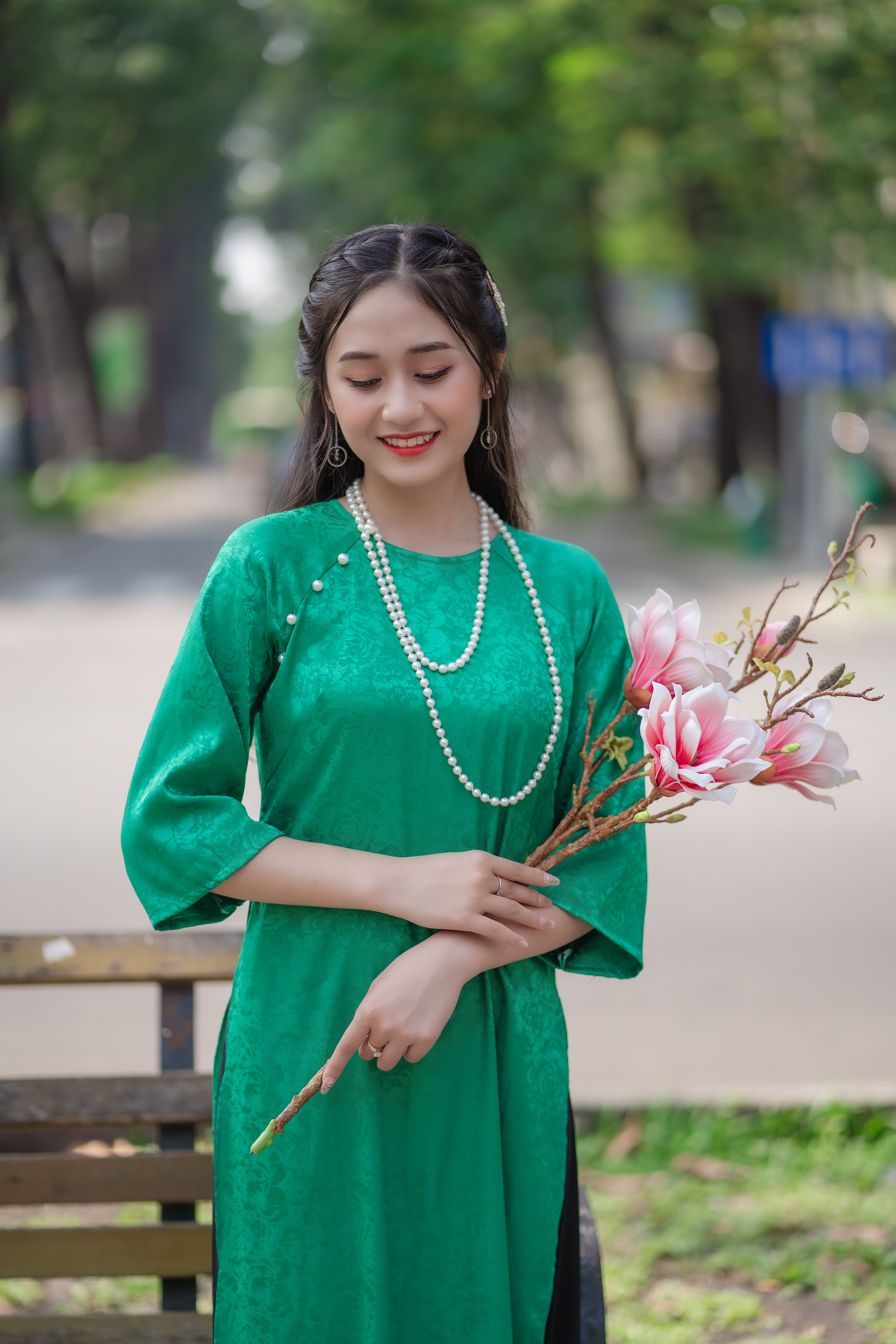 Young Smiling Model in Emerald Dress · Free Stock Photo