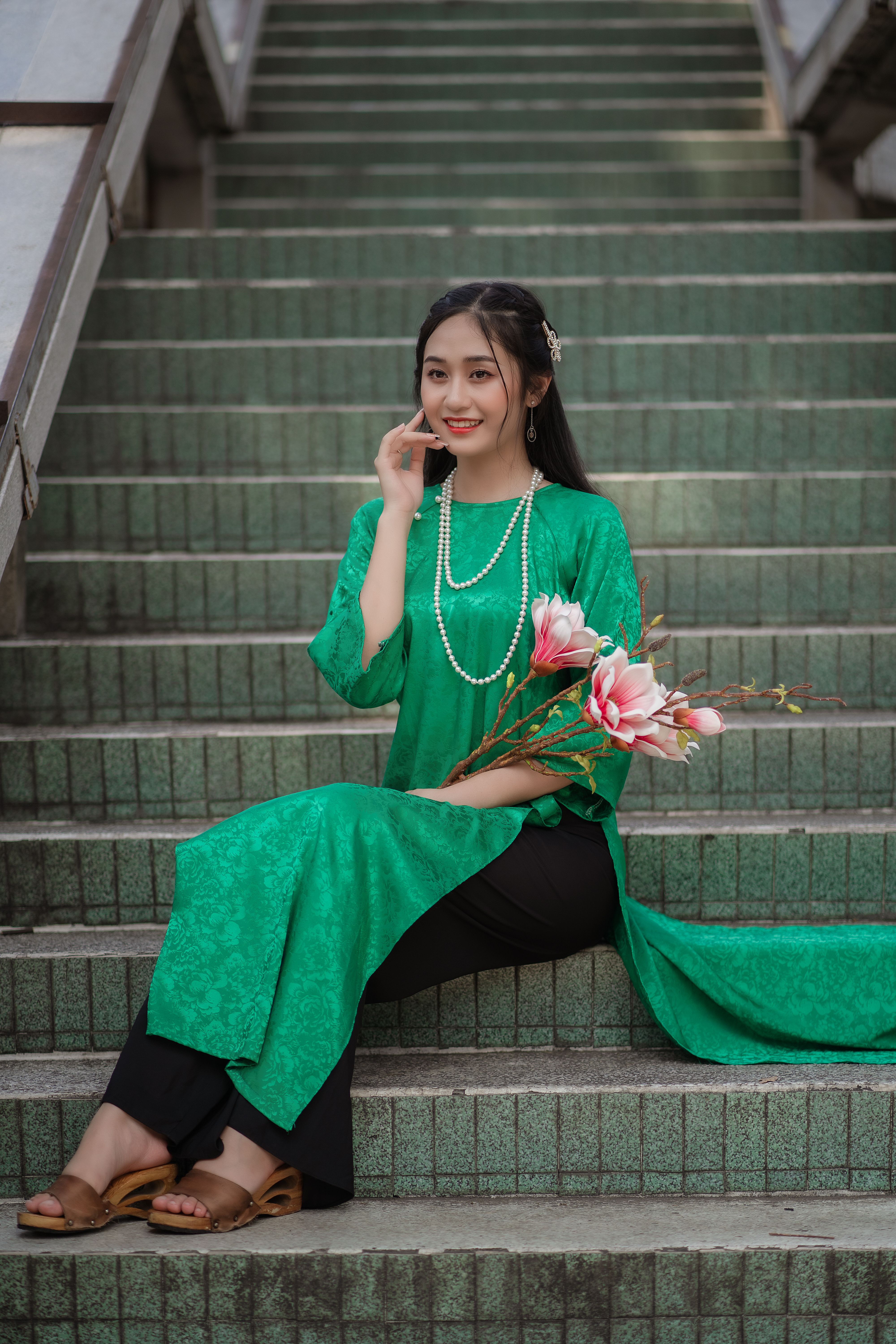 Brunette Model Sitting in Emerald Dress · Free Stock Photo