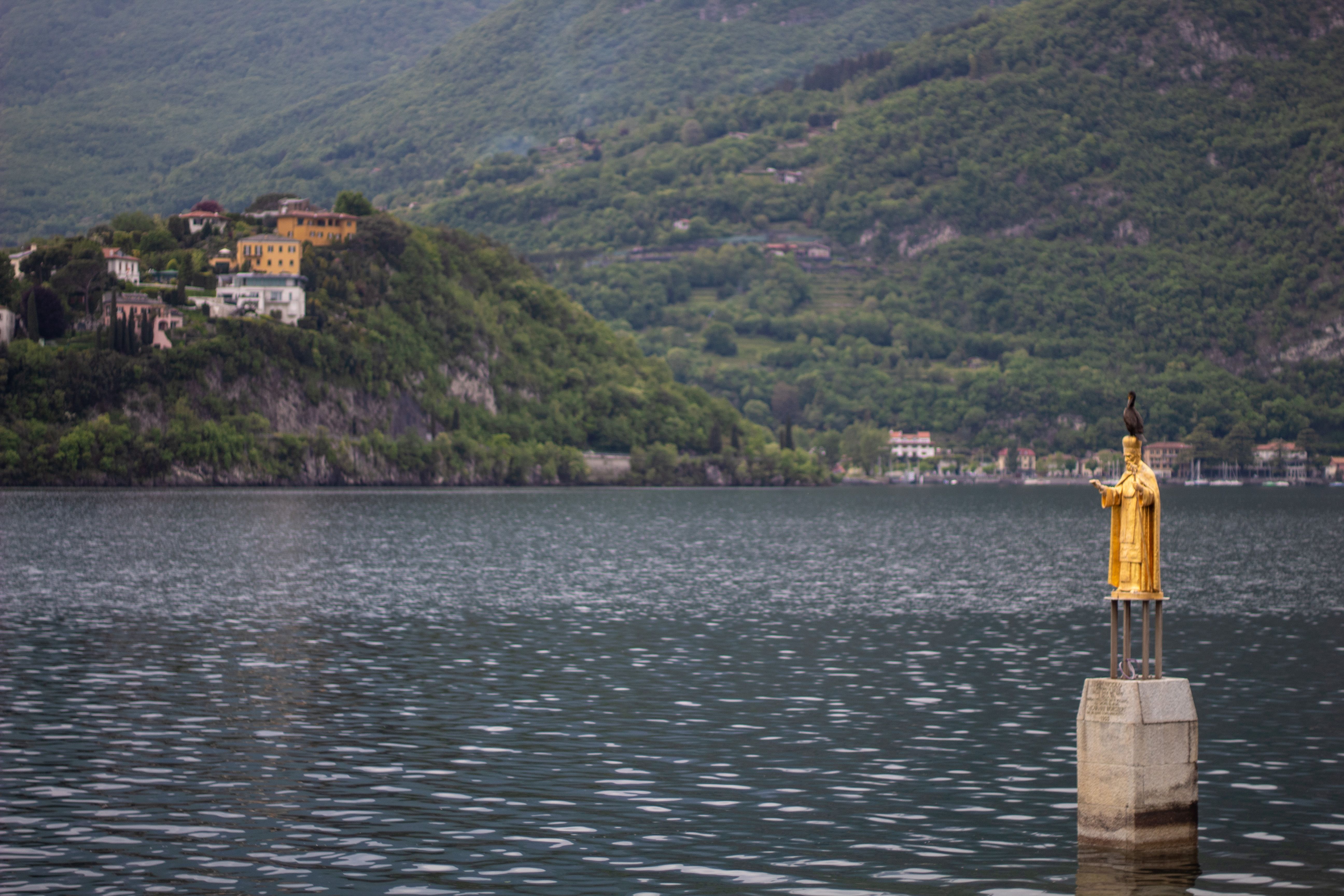 Lake Como with a Statue of San Nicolo, Lecco, Italy · Free Stock Photo