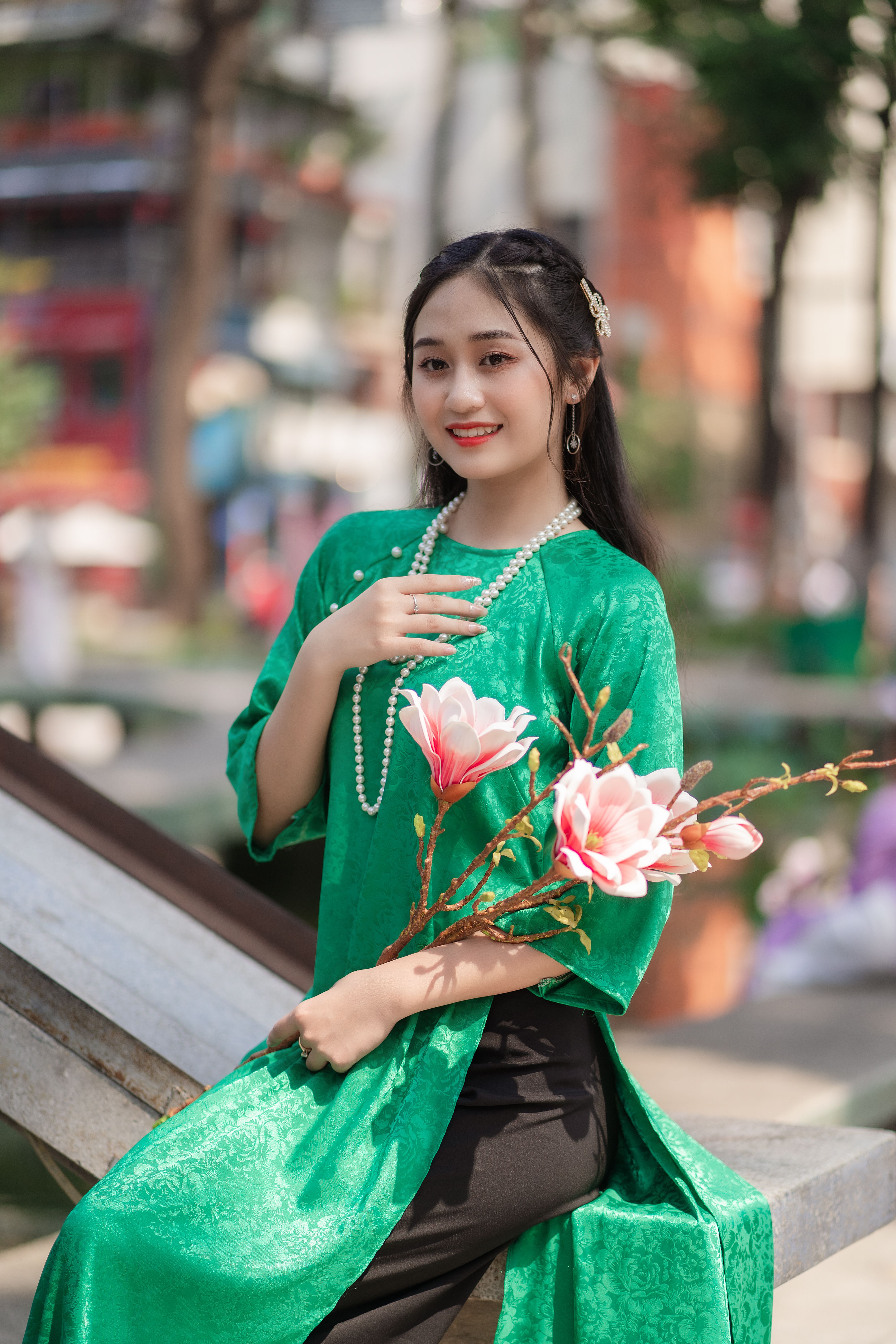 Model Posing in Emerald Dress · Free Stock Photo