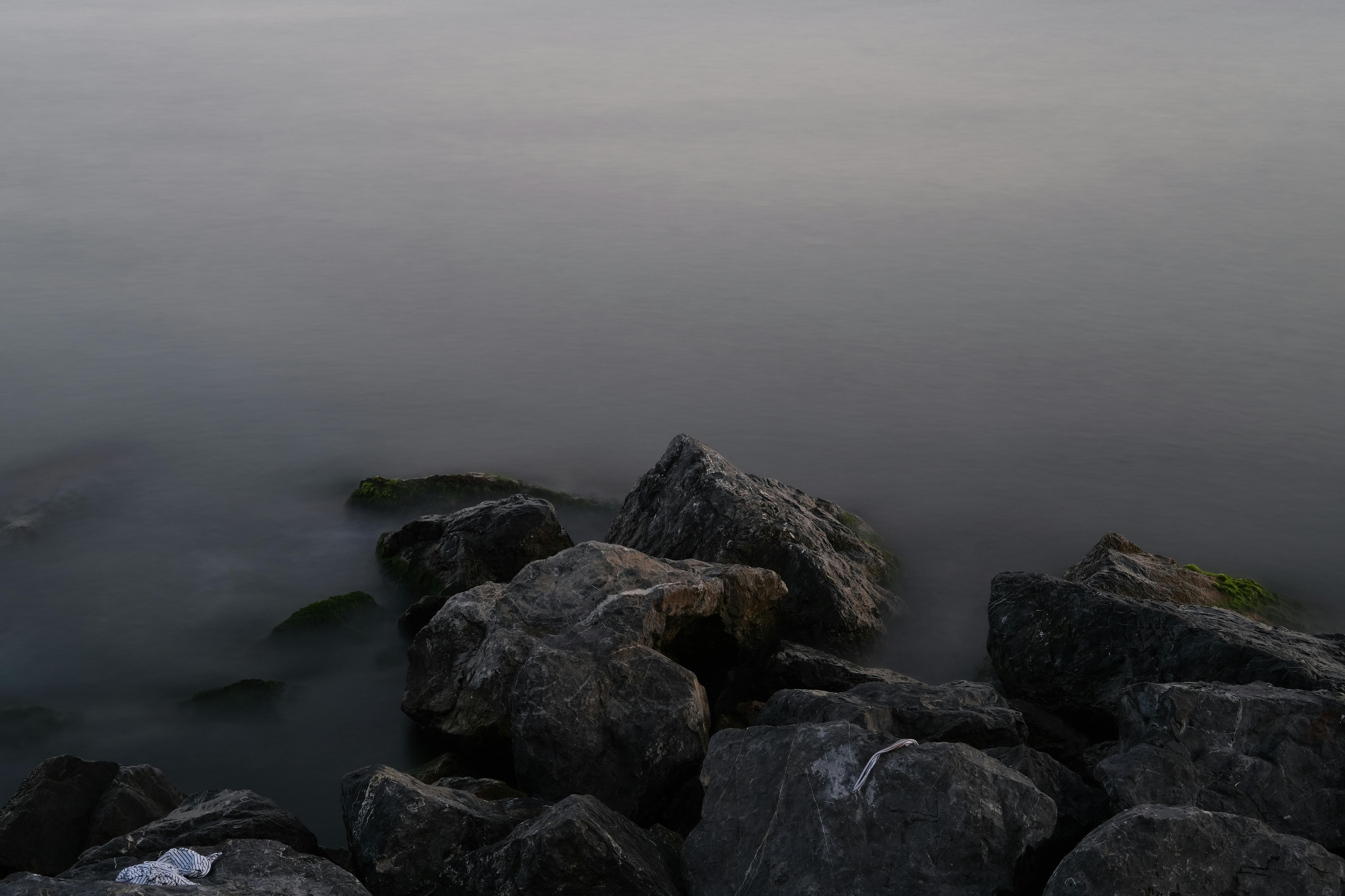 Fog over Water and the Rocks on the Shore · Free Stock Photo