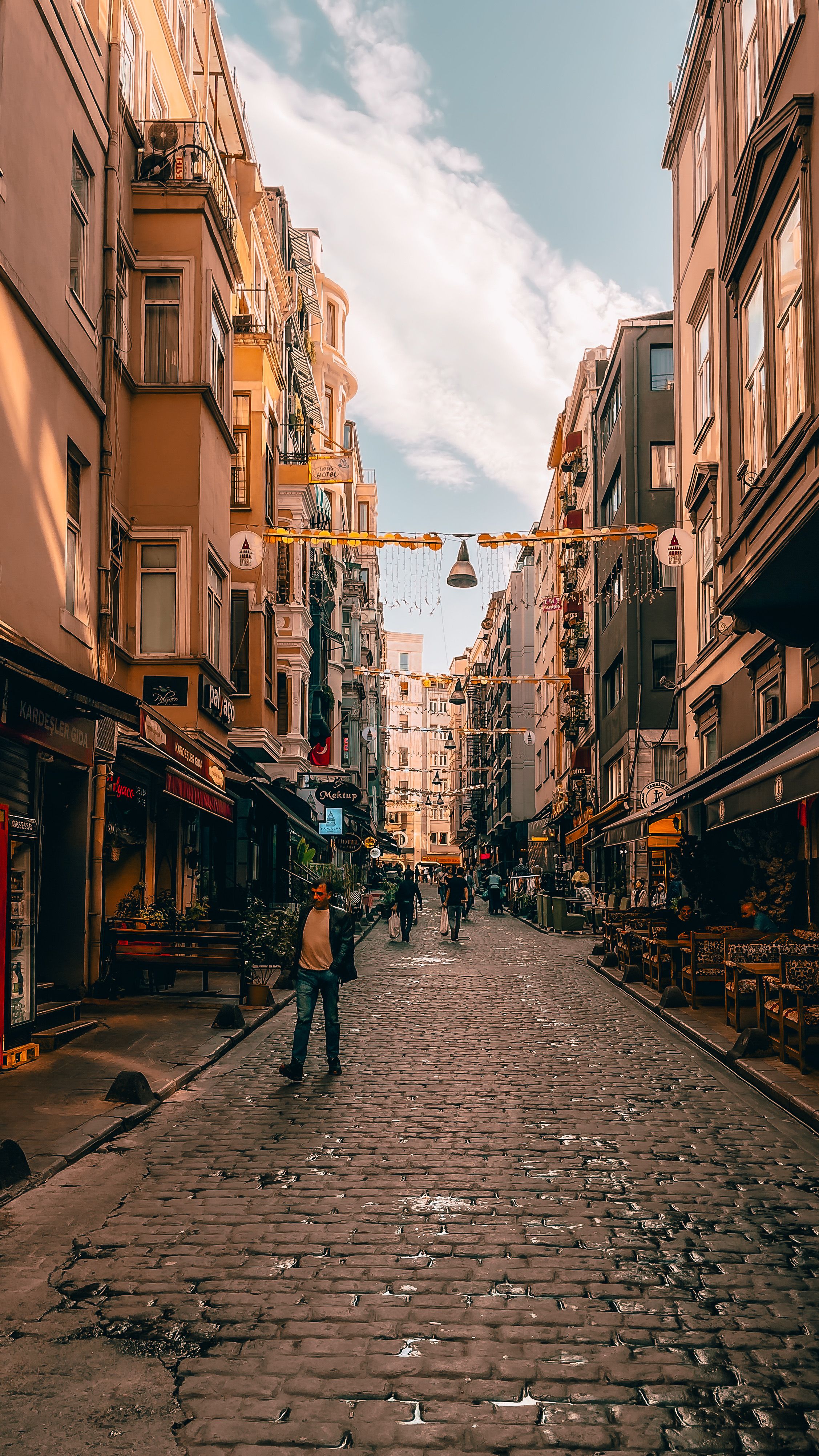 View of a Cobblestone Alley between Buildings in a City · Free Stock Photo
