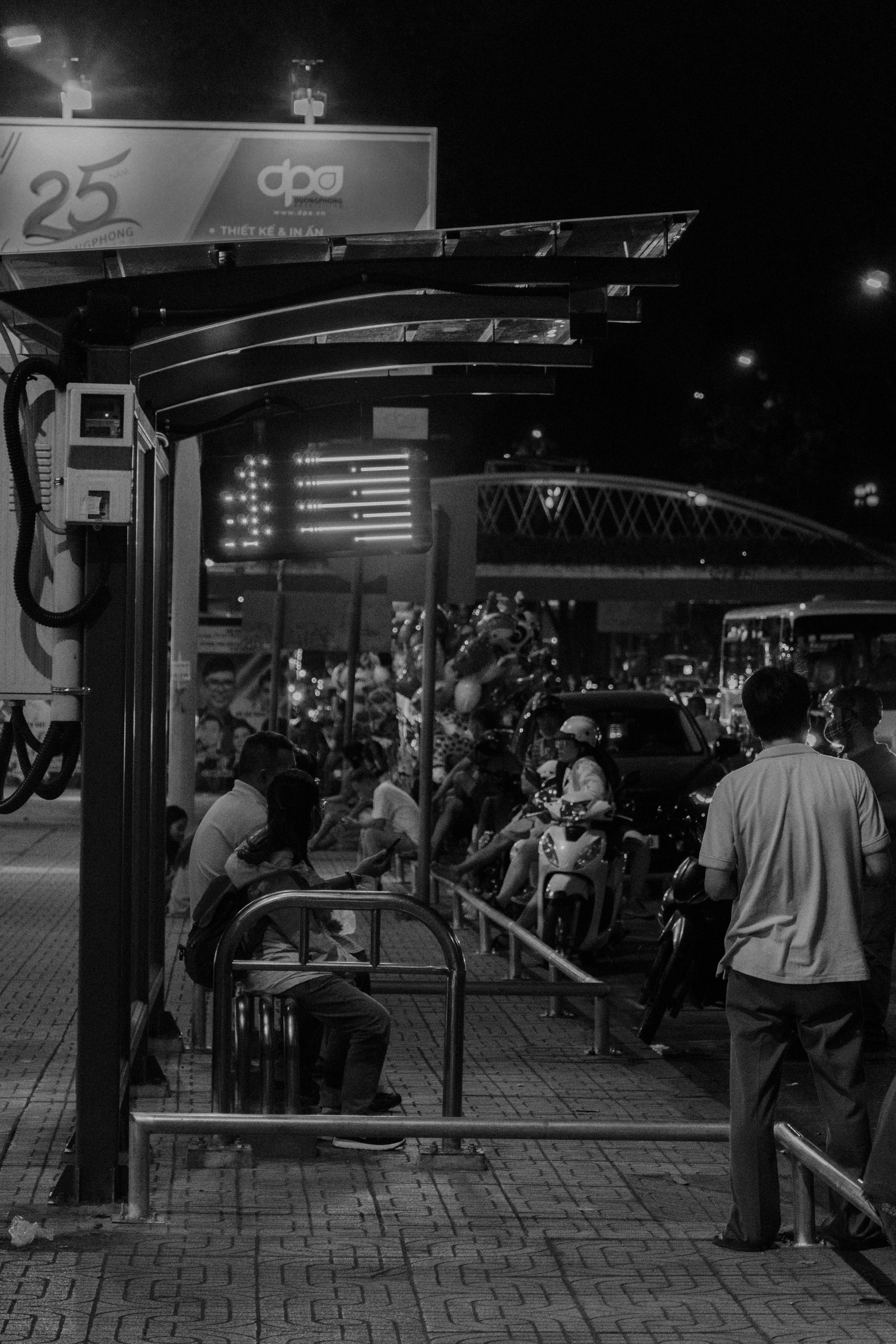 People Waiting at Bus Stop at Night · Free Stock Photo