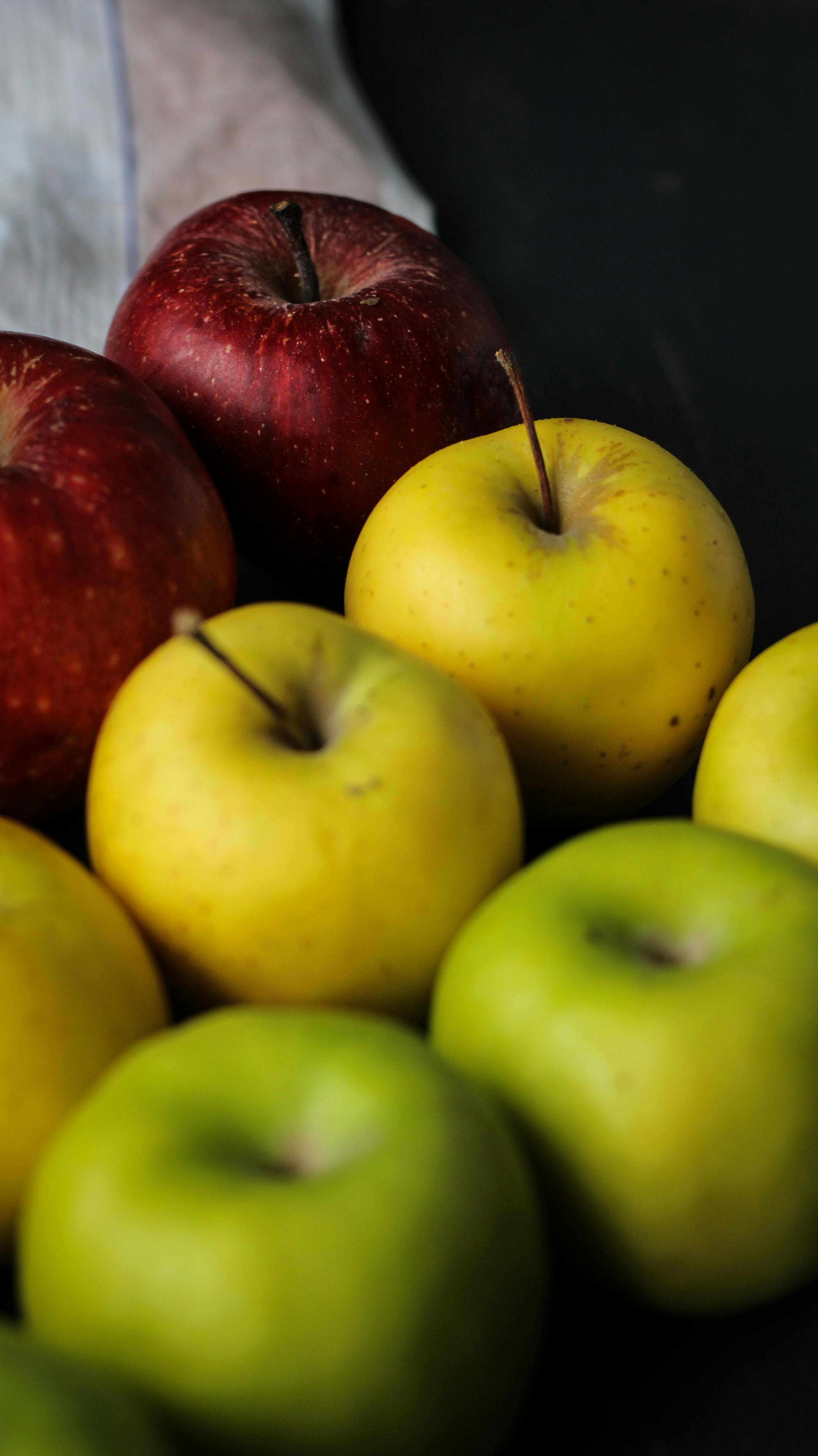 Red Apple With Two Green Apples · Free Stock Photo