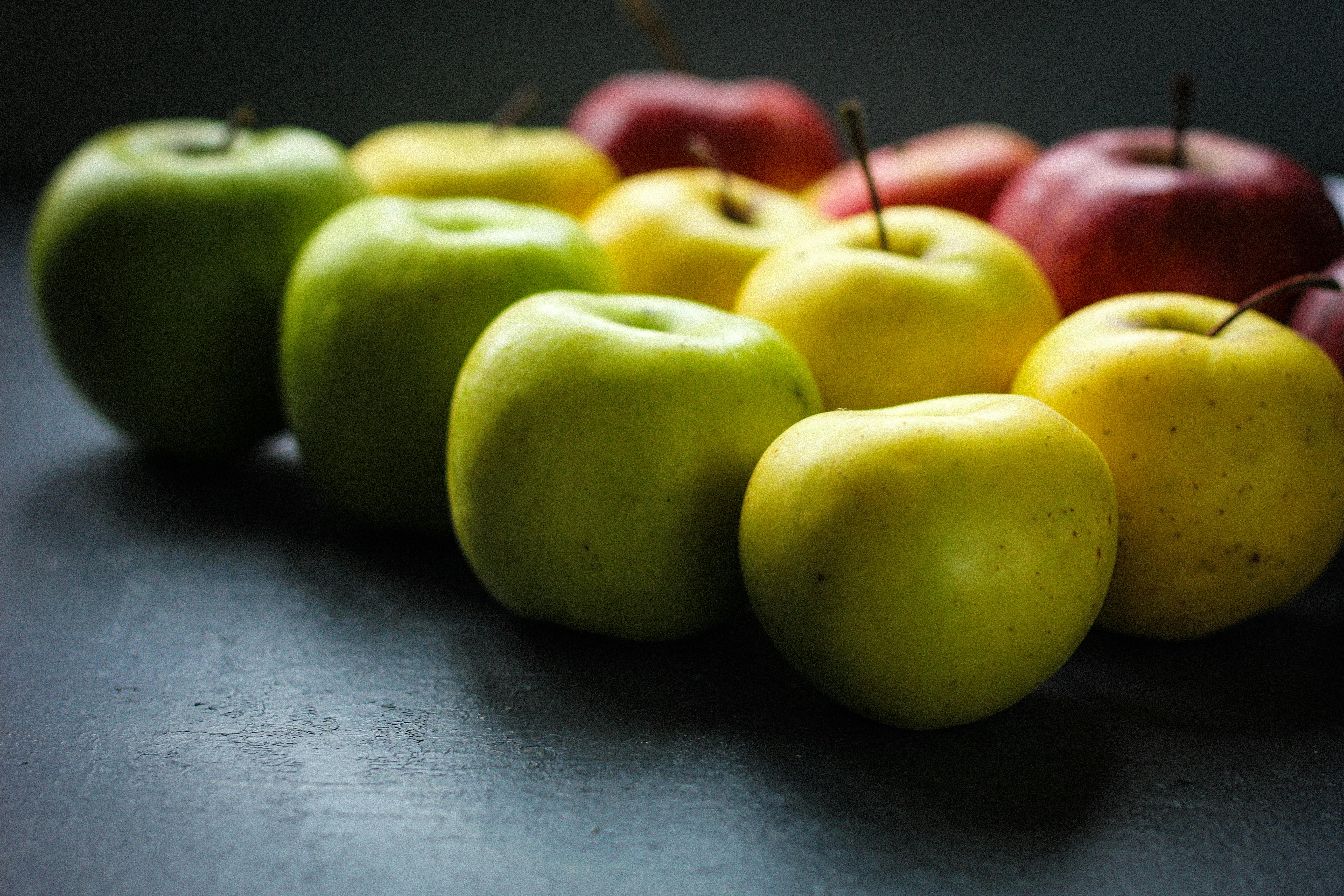 Red Apple With Two Green Apples · Free Stock Photo