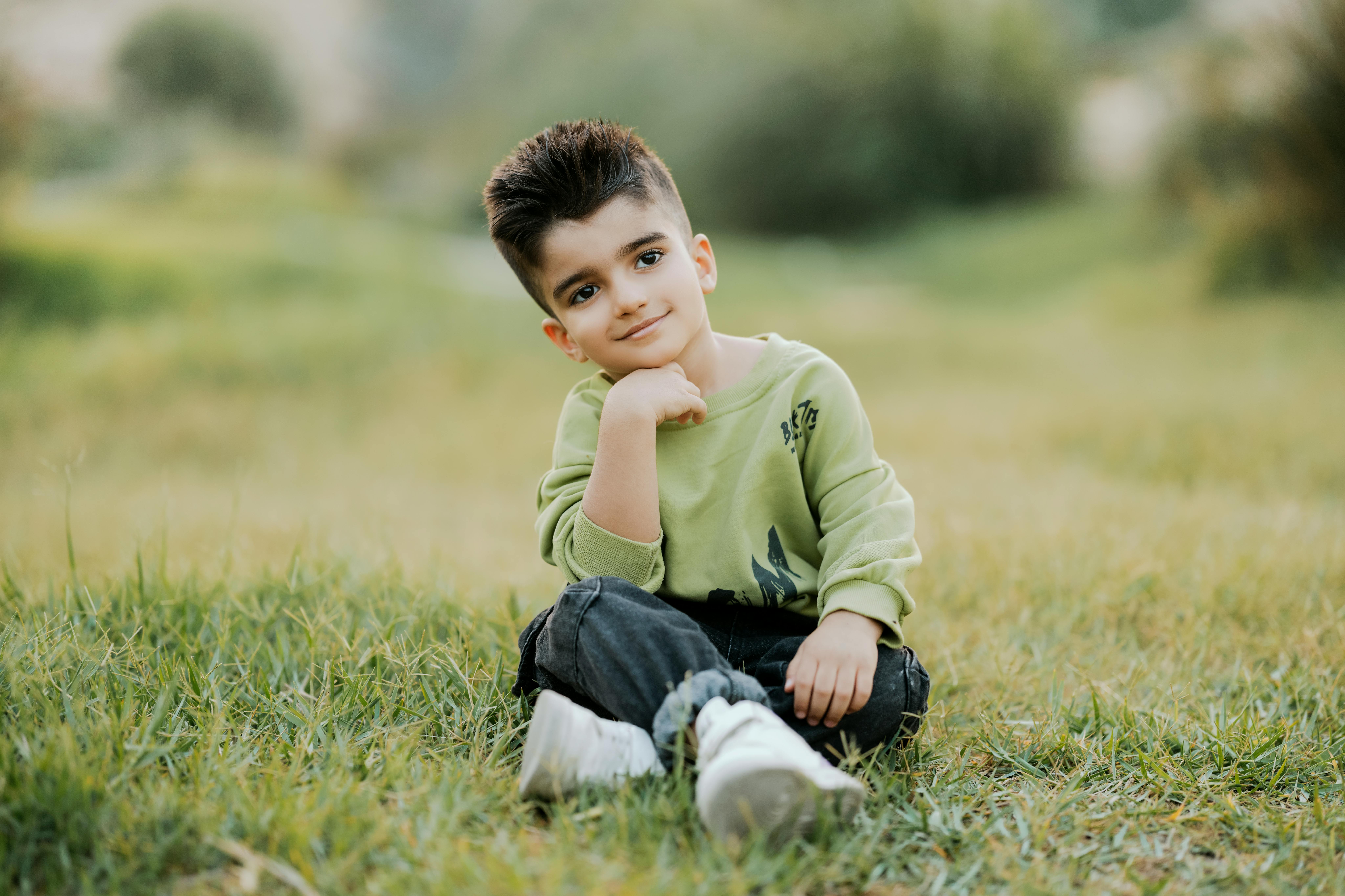 Little Bot Sitting on a Meadow · Free Stock Photo