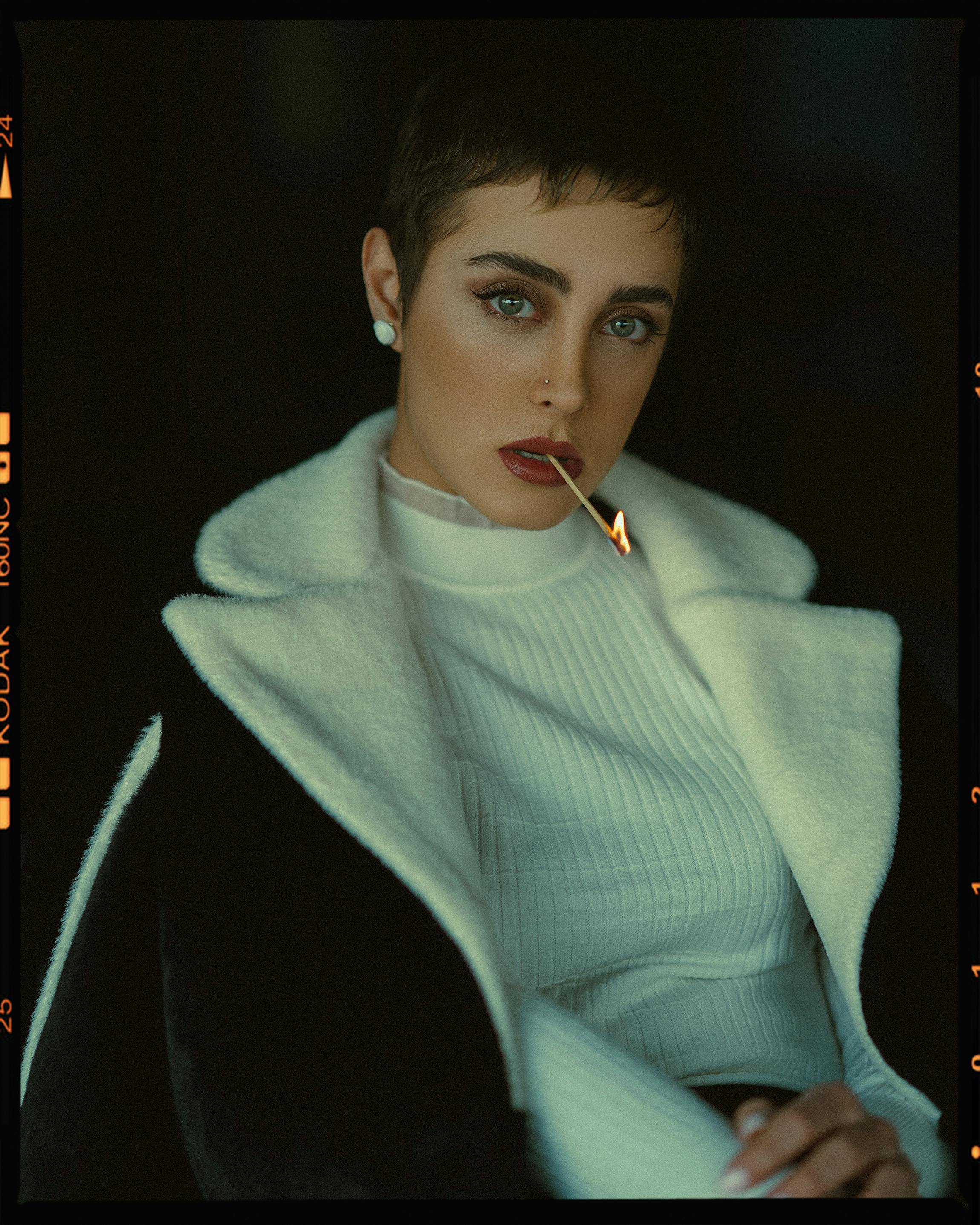 Model Posing in Sweater and Jacket · Free Stock Photo