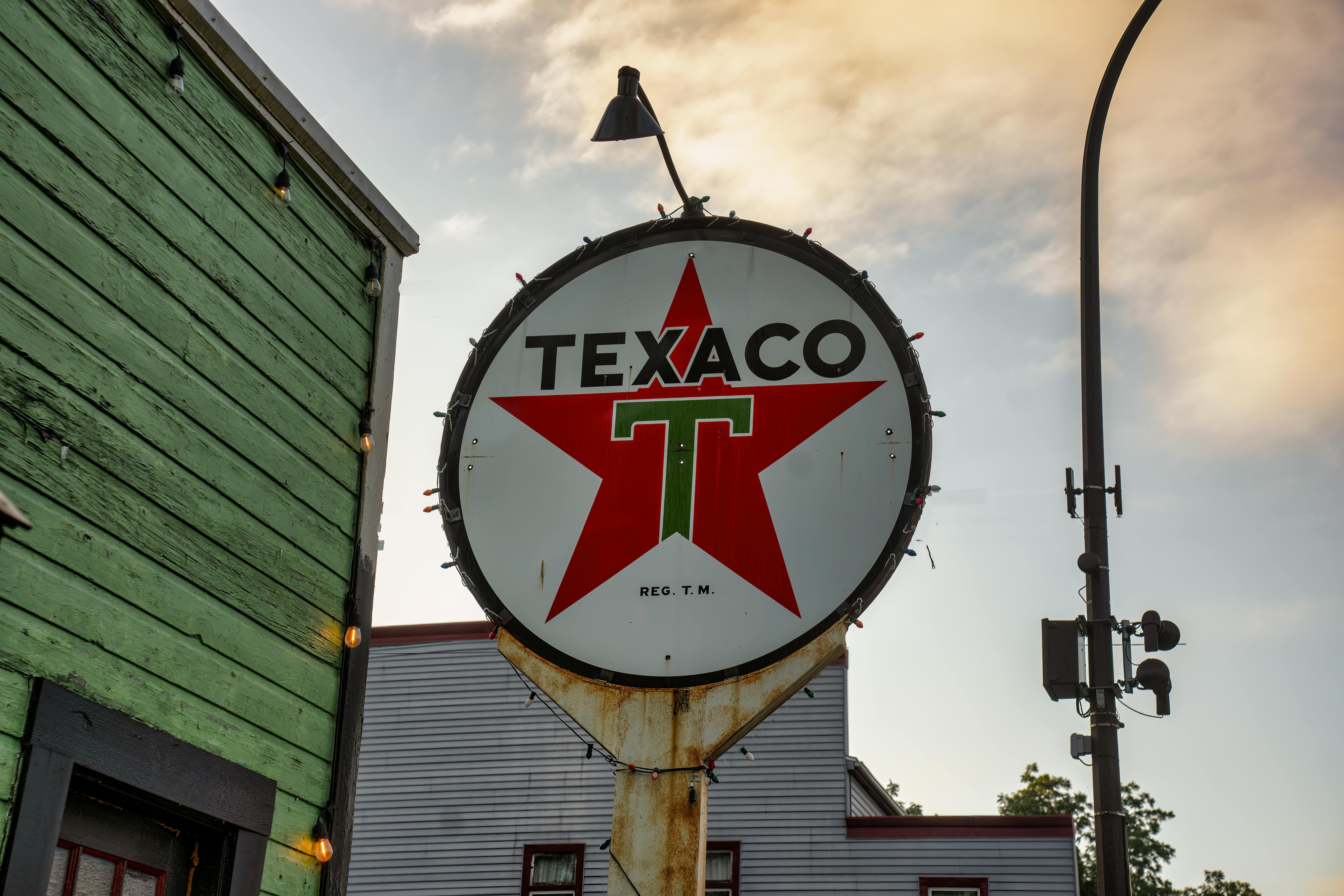 Close-up of a Vintage Texaco Sign on the Street in City · Free Stock Photo