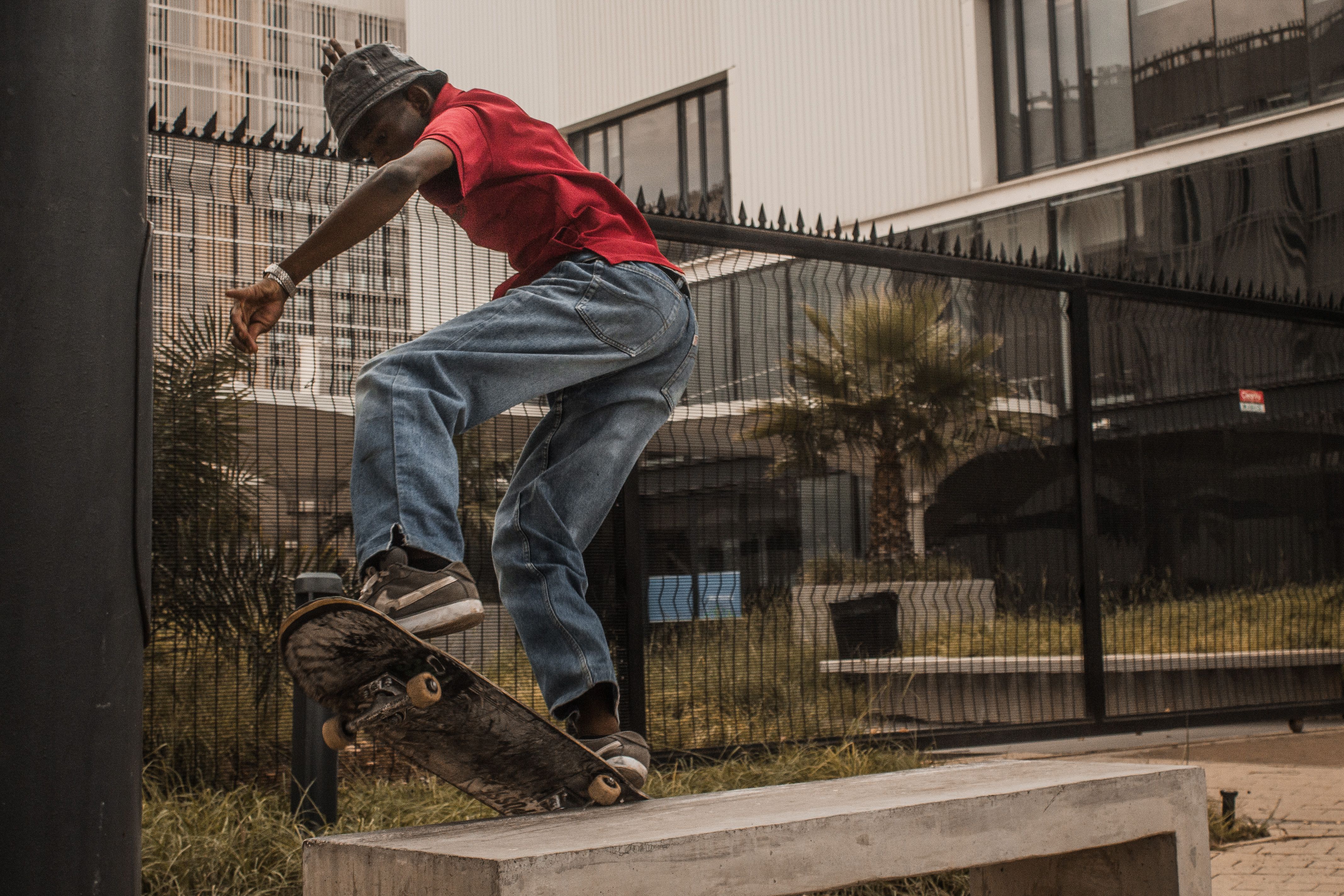 Skater Sliding on a Concrete Bench · Free Stock Photo