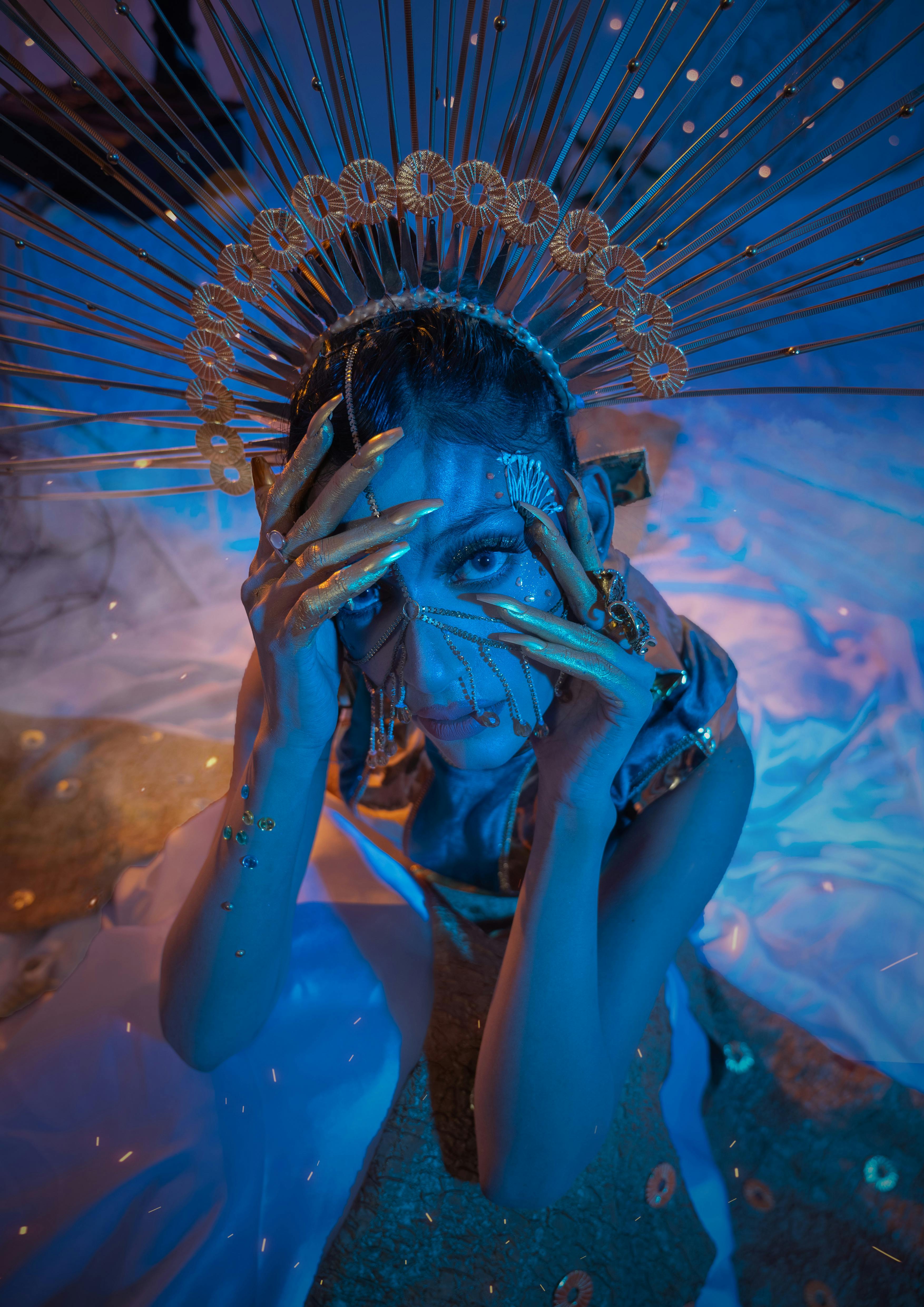 Woman in an Angel Costume with Flowers in the Background · Free Stock Photo