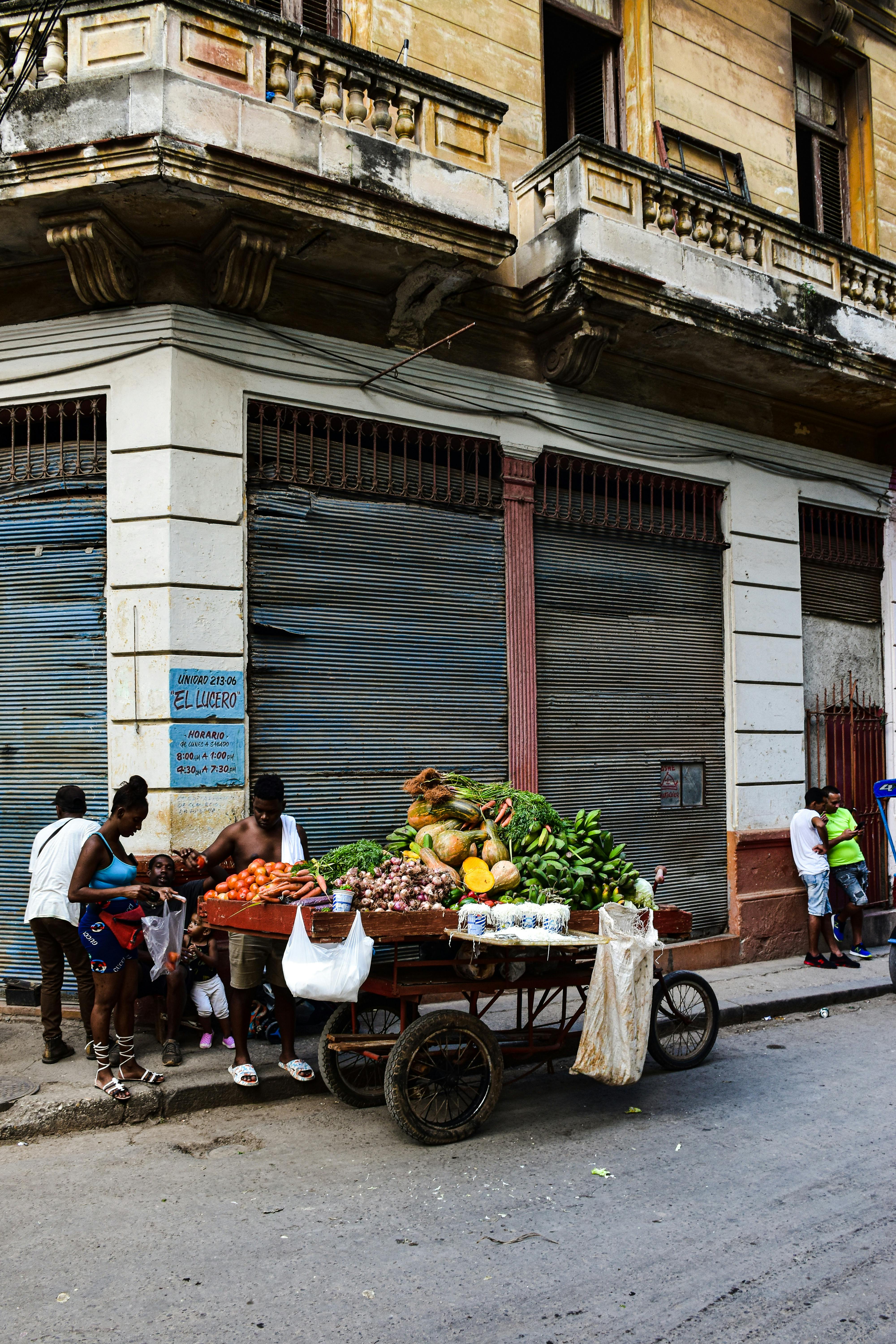 Merchant with Cart Filled with Merchandise · Free Stock Photo