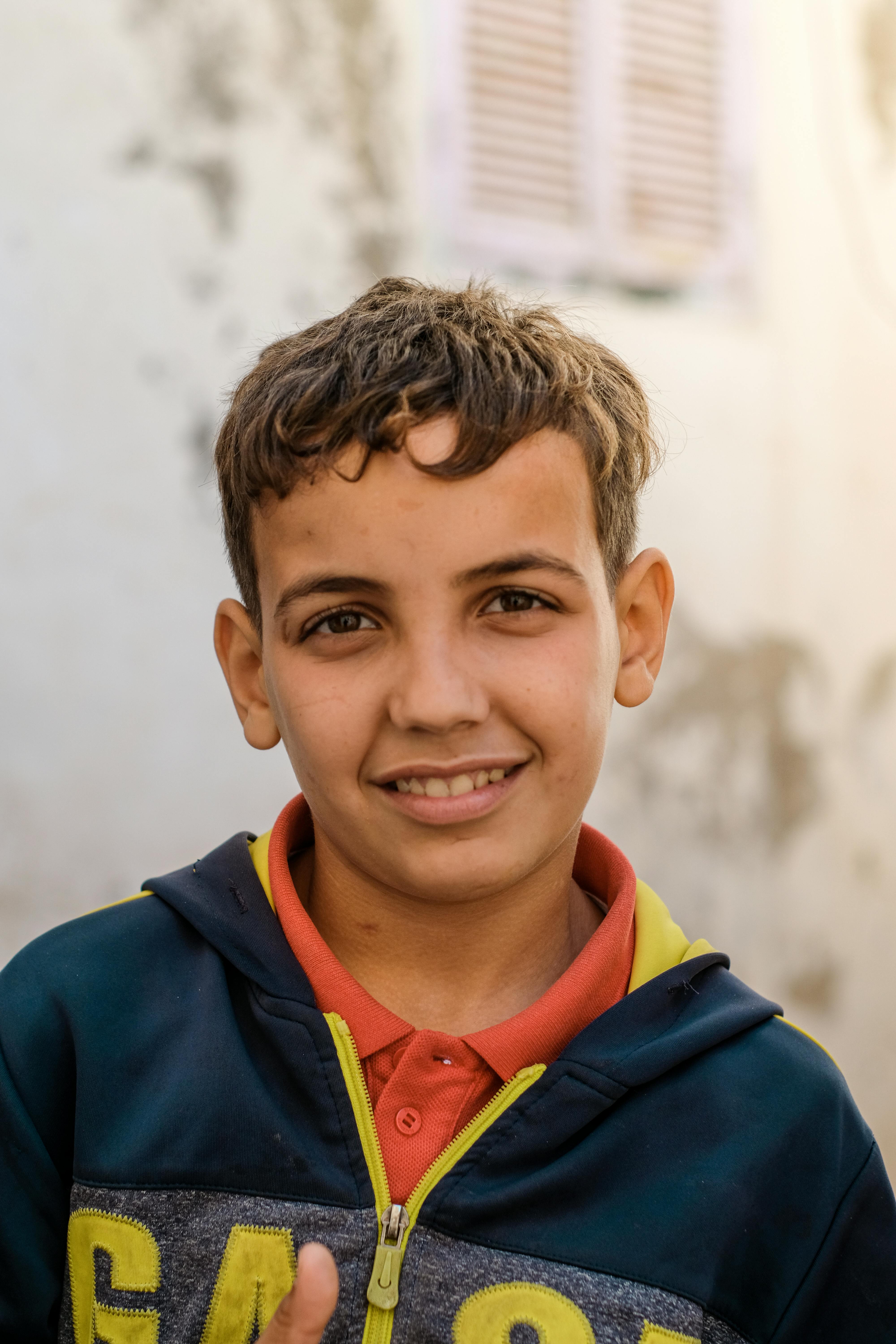 Portrait of Smiling Child on Street · Free Stock Photo