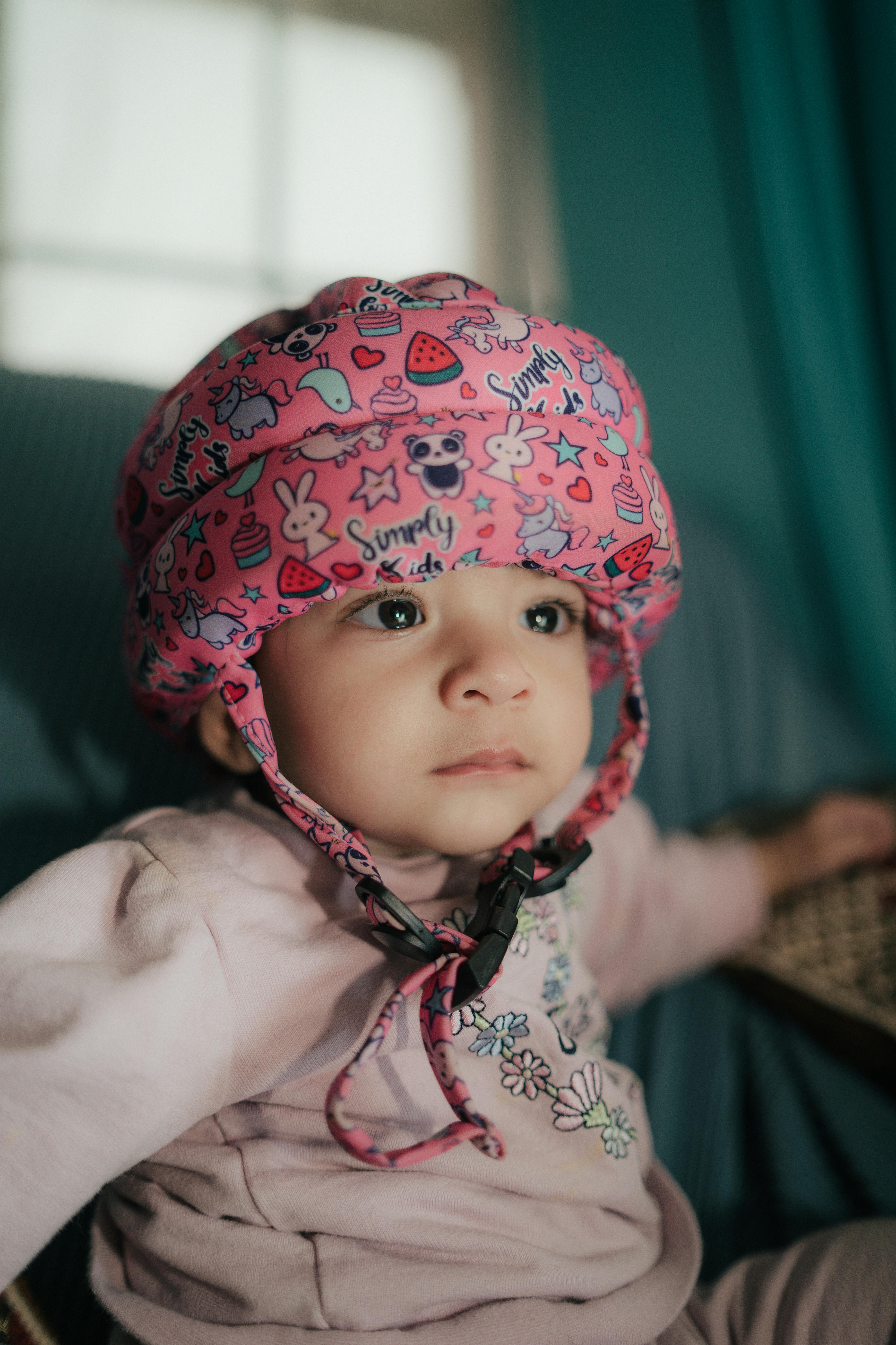 Cute Girl in Hat Sitting on Chair · Free Stock Photo