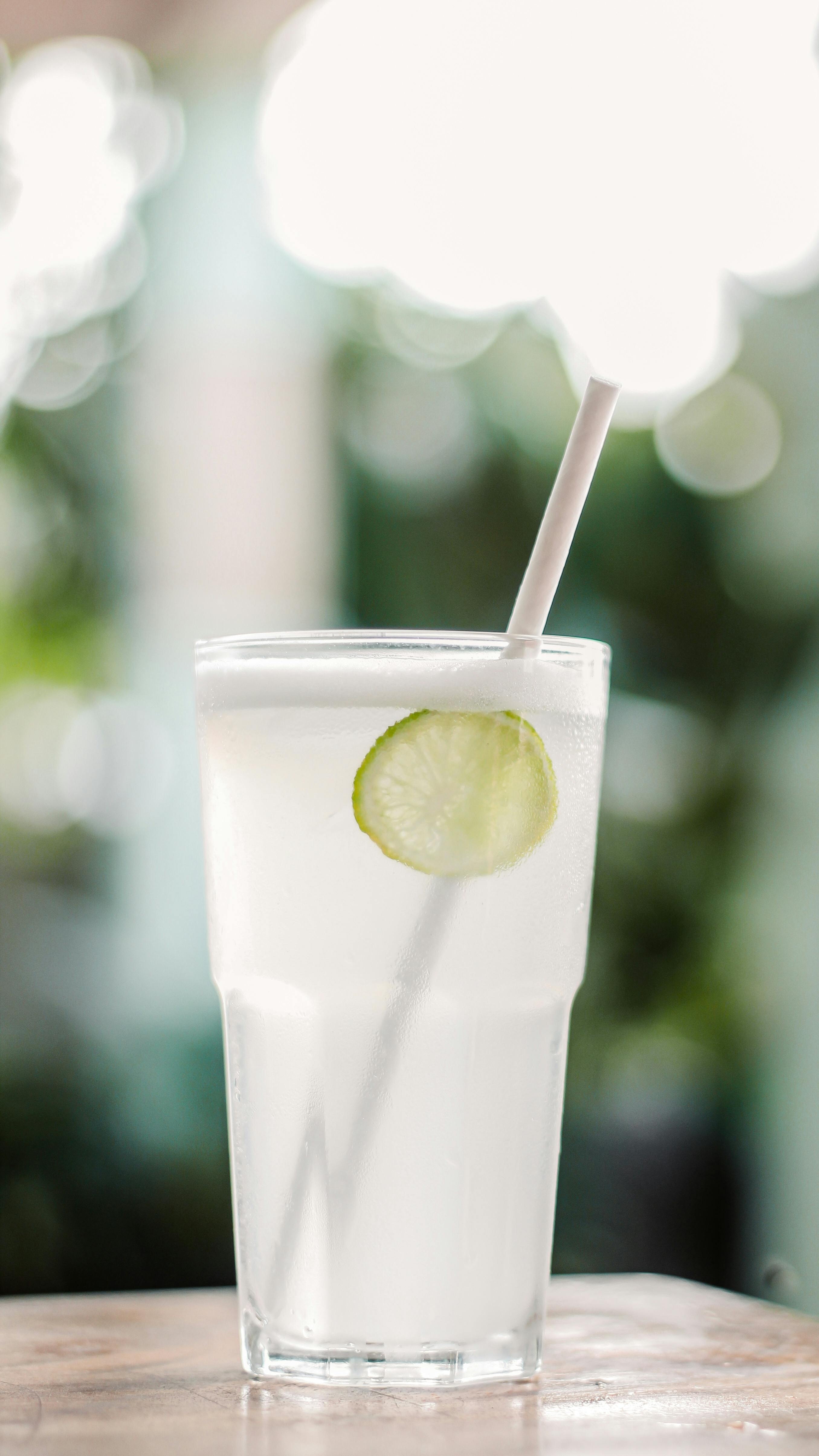 Cocktail with Straw and Lime Slice · Free Stock Photo