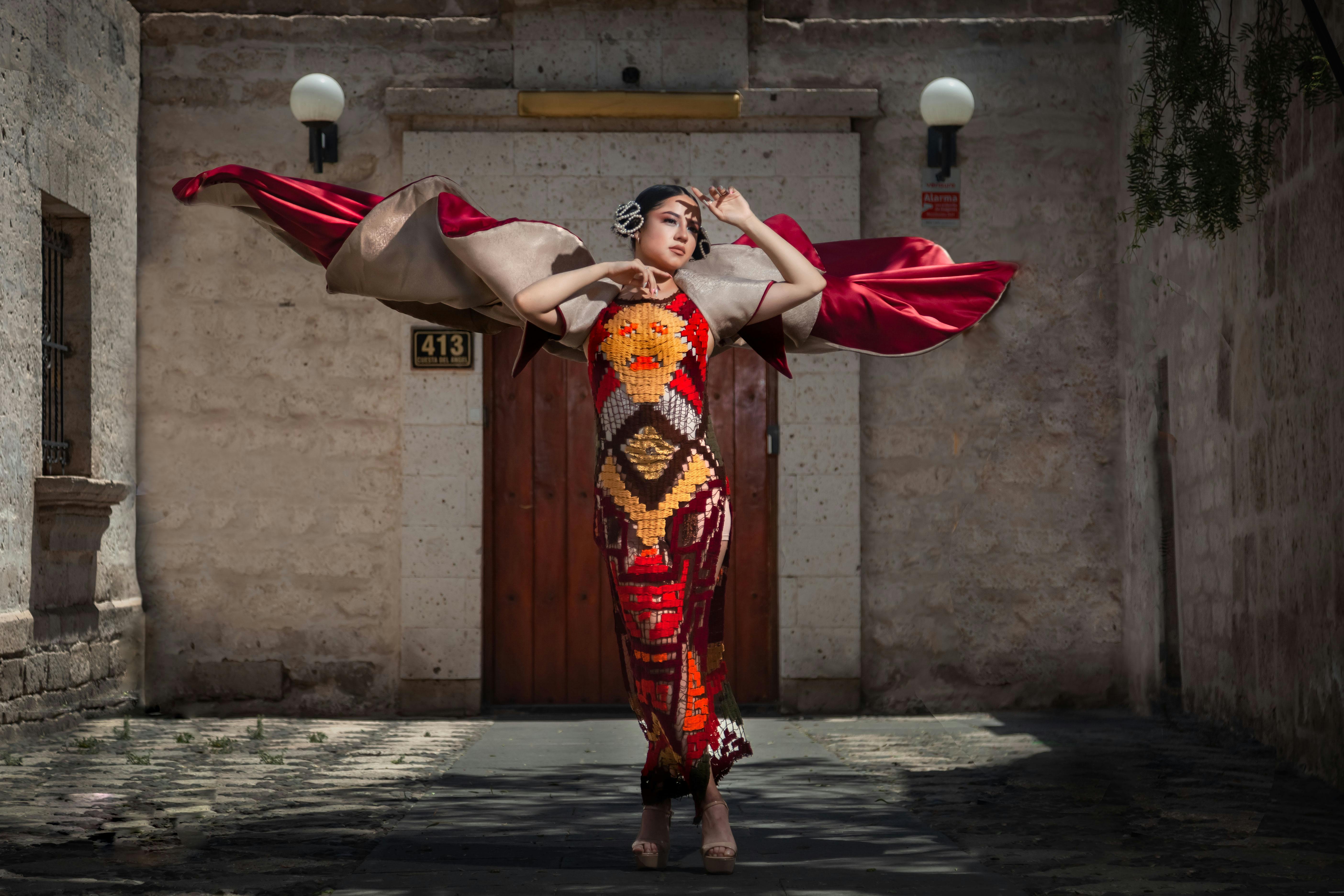 Young Woman in a Dress and her Cloak Blowing in Wind · Free Stock Photo