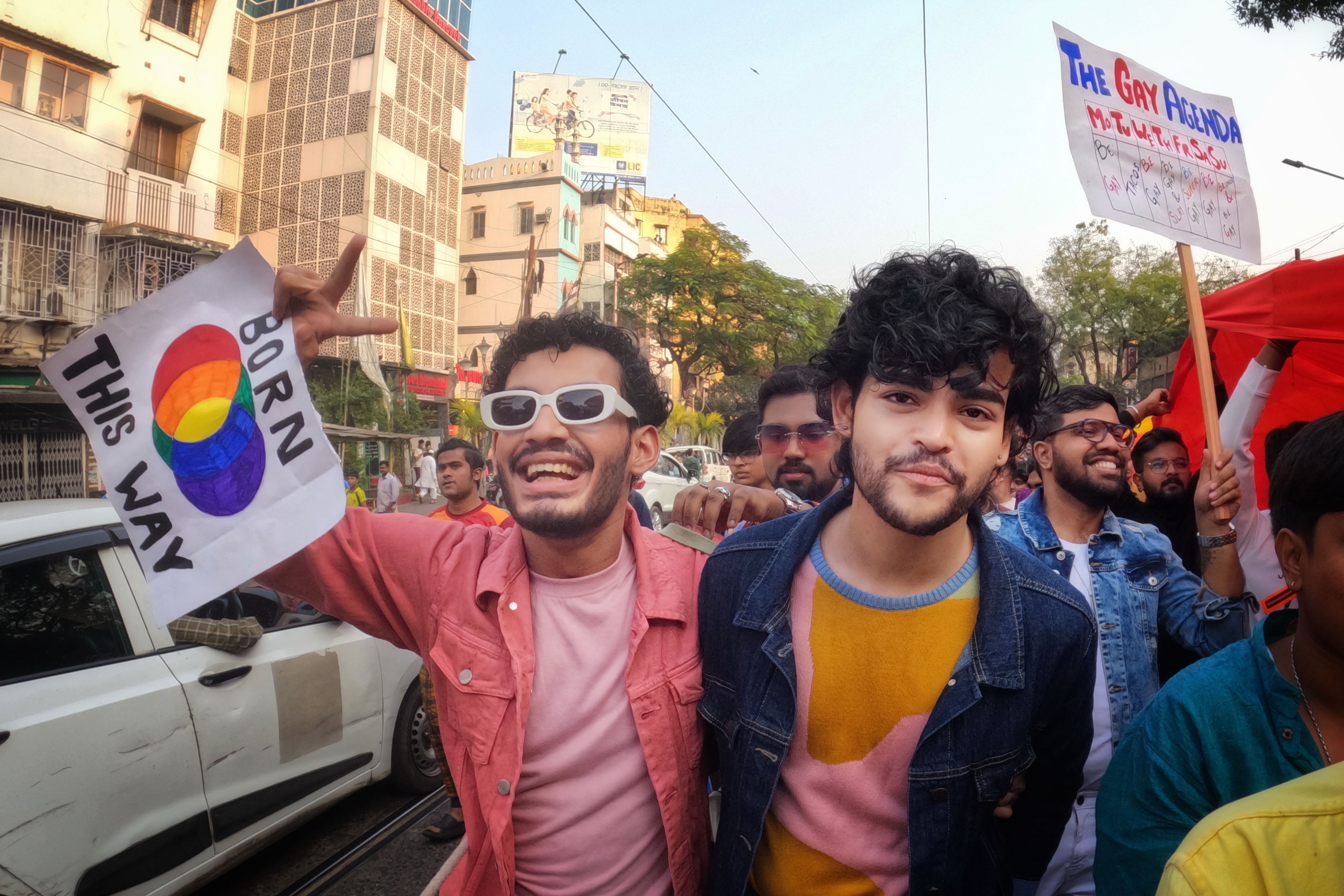 LGBTQ Pride Parade Crowd with Rainbow Flag · Free Stock Photo