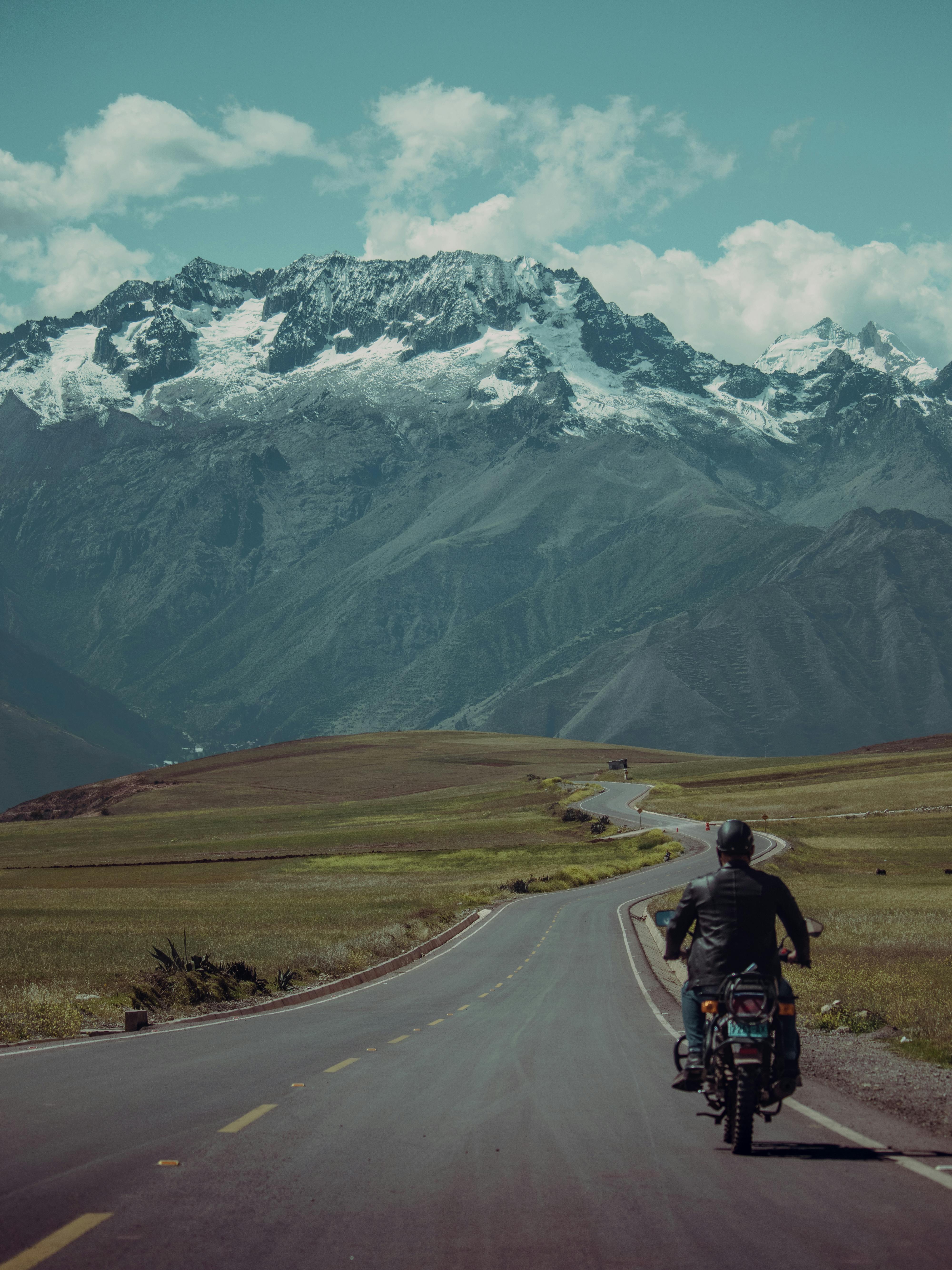 Back View of a Man Riding on a Motorcycle with Additional Seat on the ...