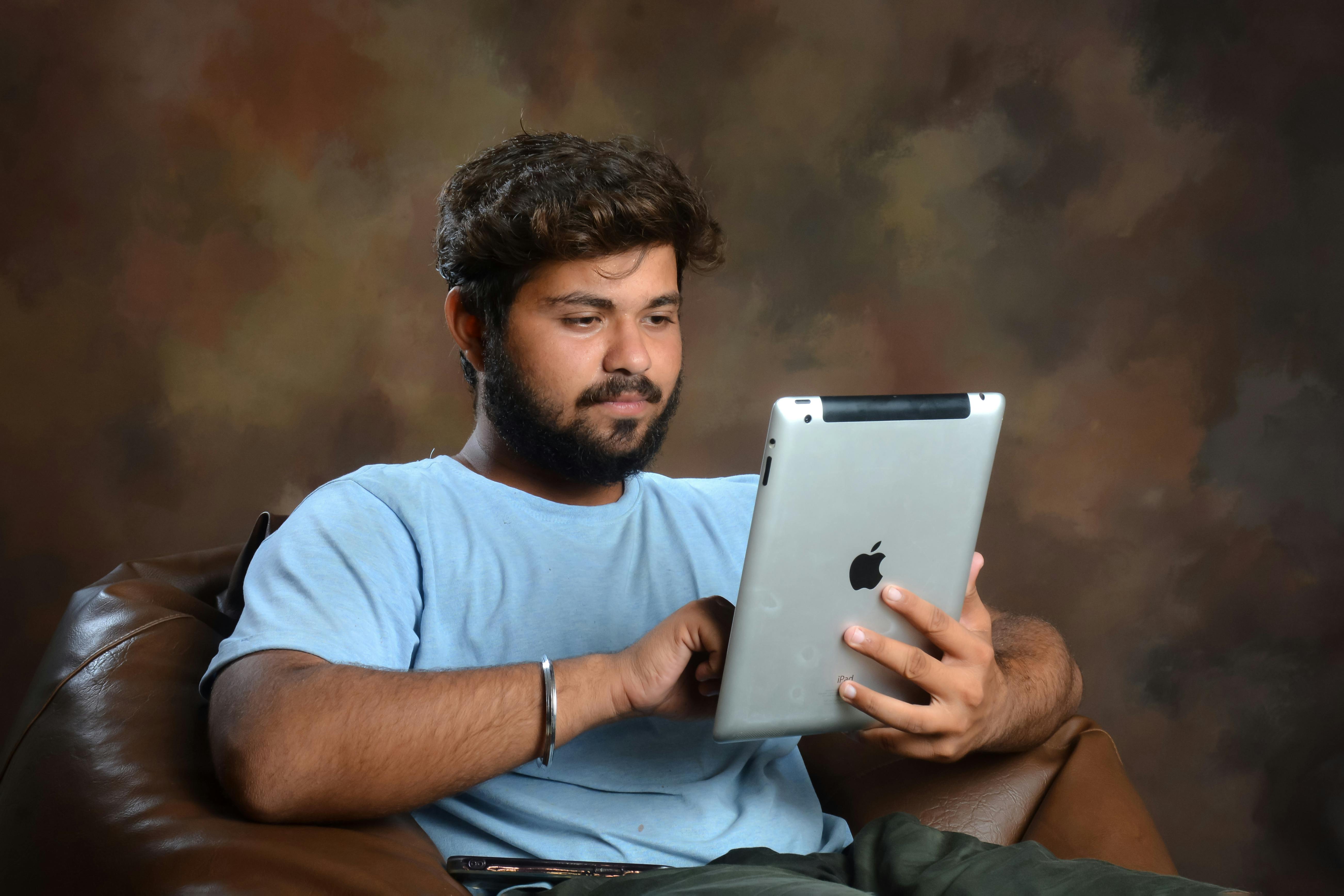 Sitting Man with iPad · Free Stock Photo