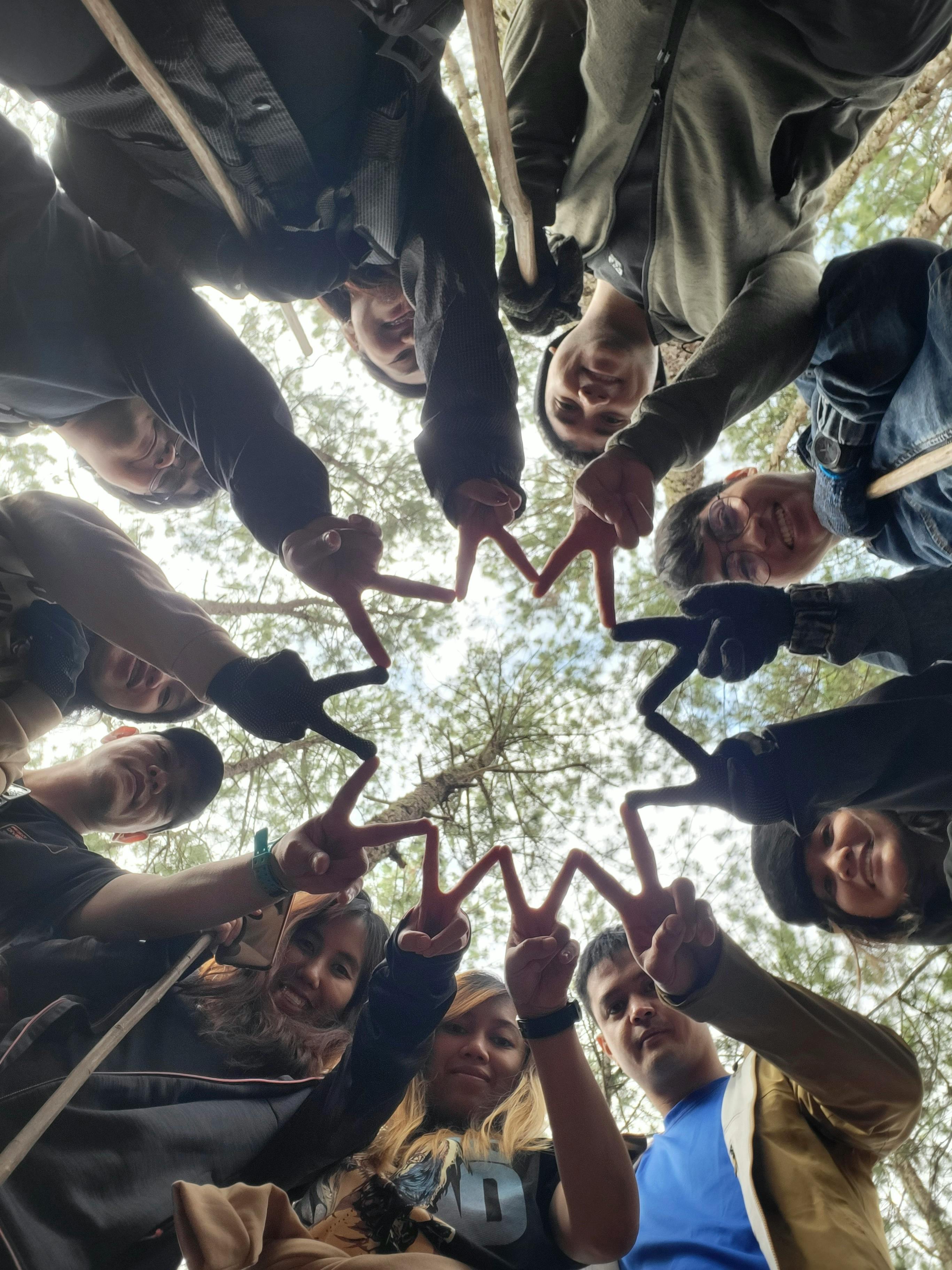 Group of People Forming Star Using Their Hands · Free Stock Photo
