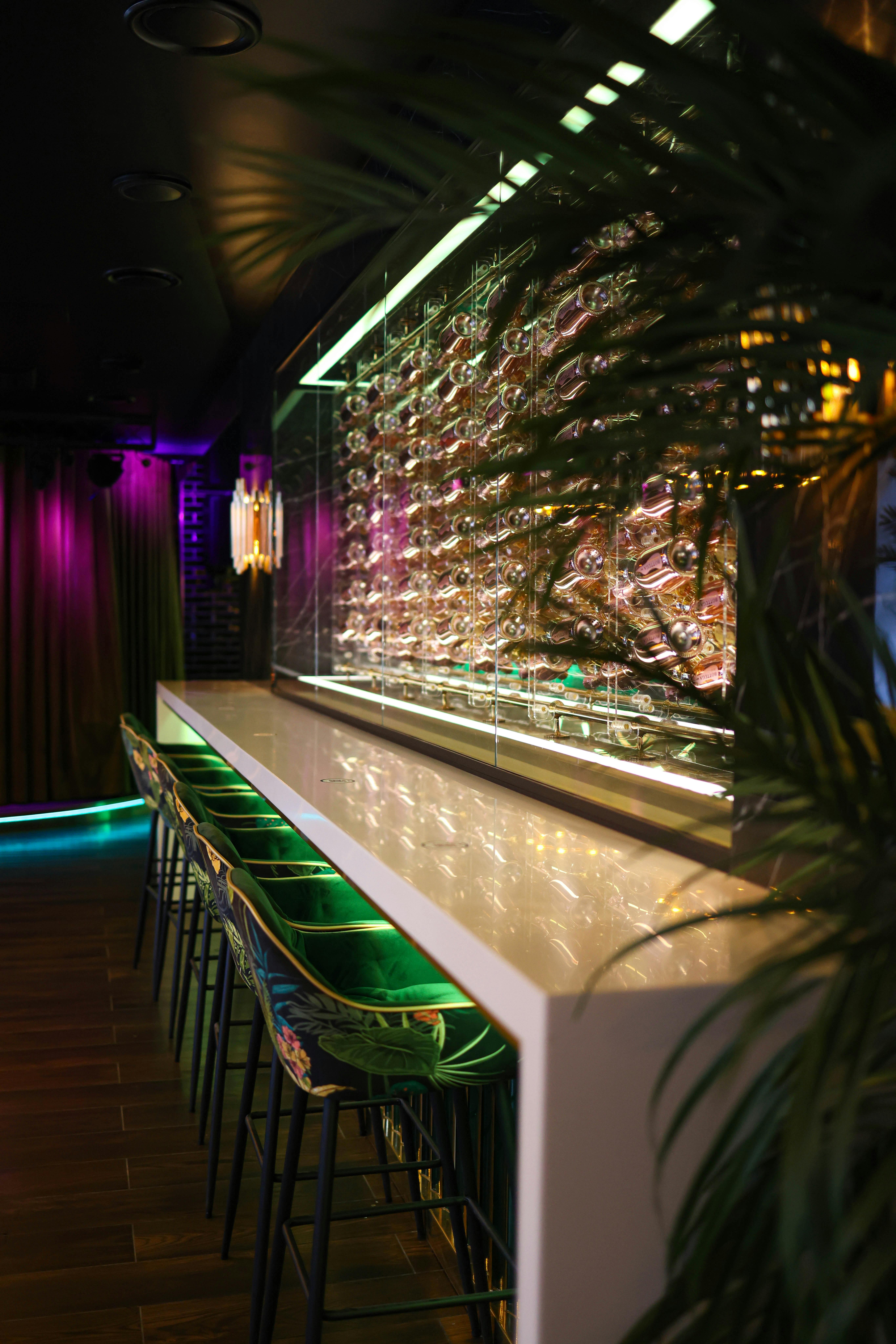 Empty Bar with Illuminated Neon Sign · Free Stock Photo