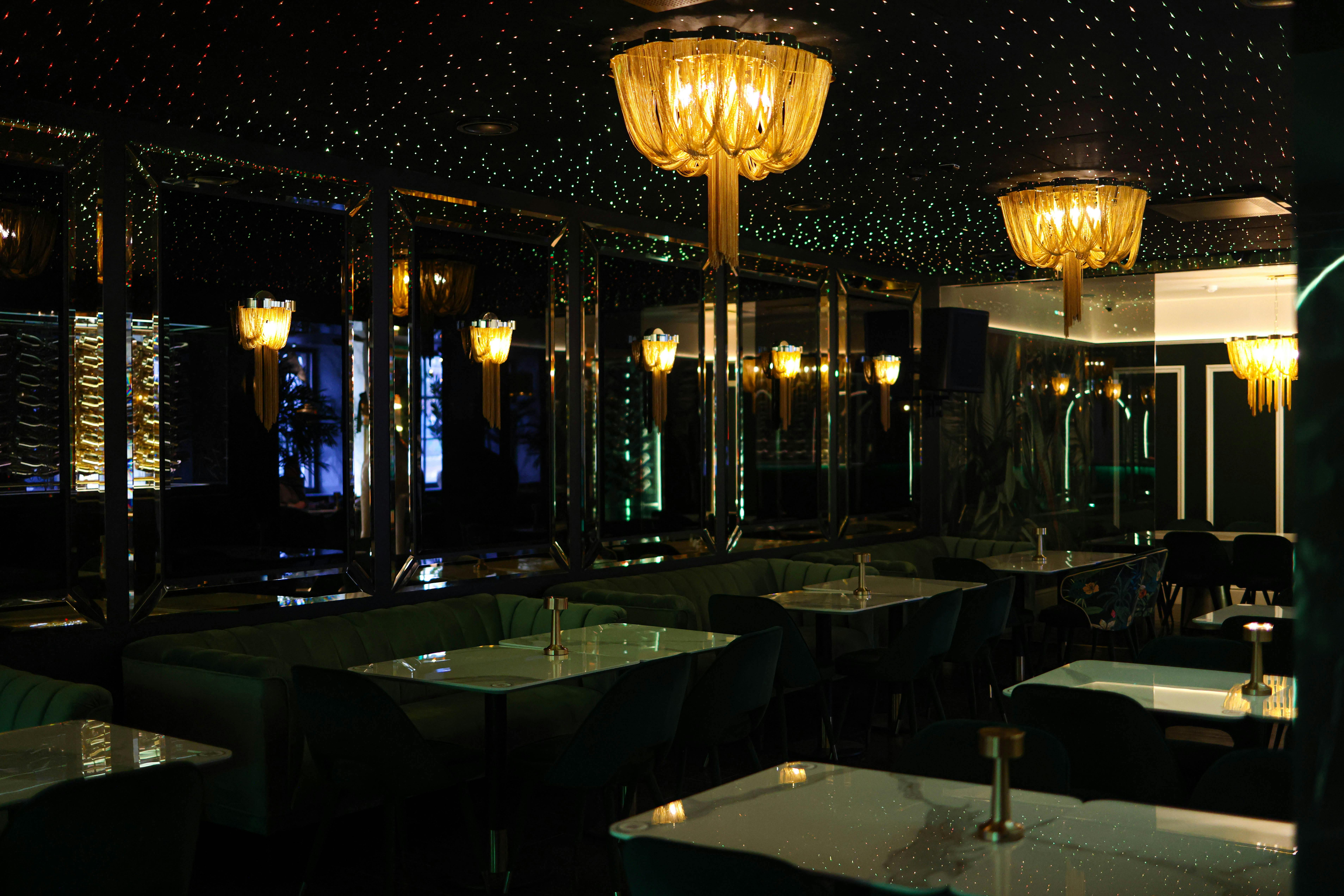 Empty Bar with Illuminated Neon Sign · Free Stock Photo