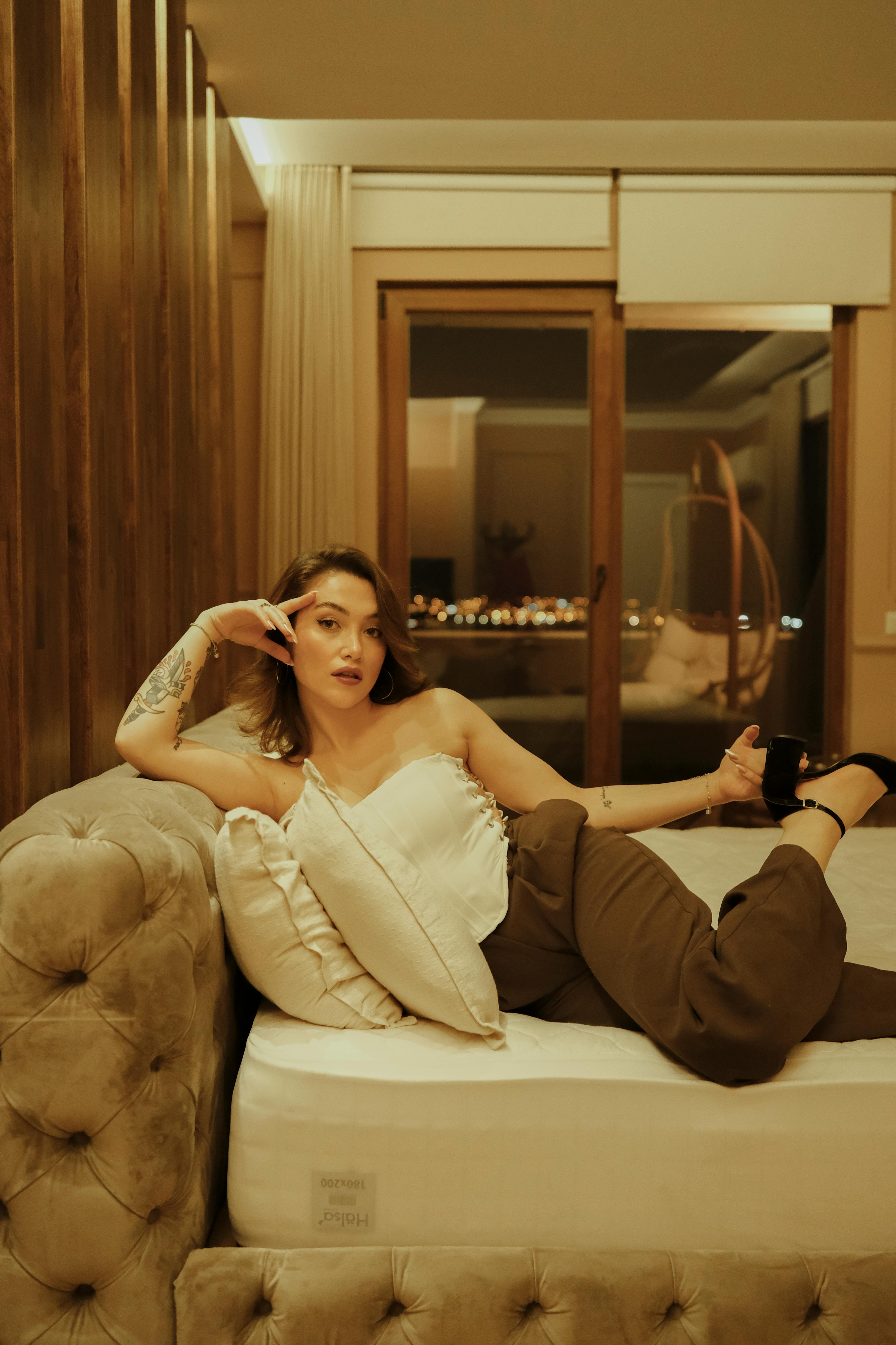 Woman in High Heels on Bed · Free Stock Photo