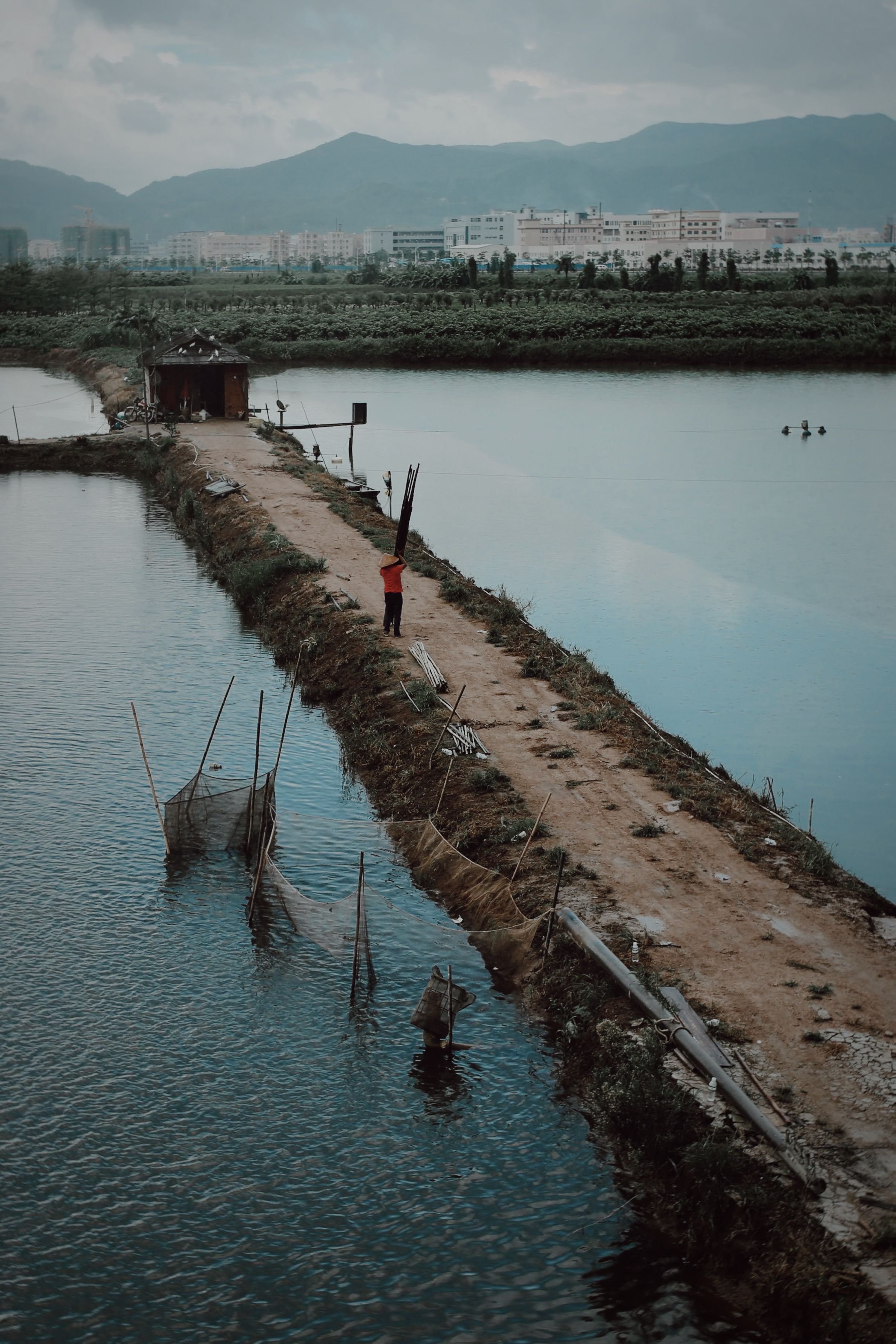Landscape with a Dam and Water Reservoirs · Free Stock Photo