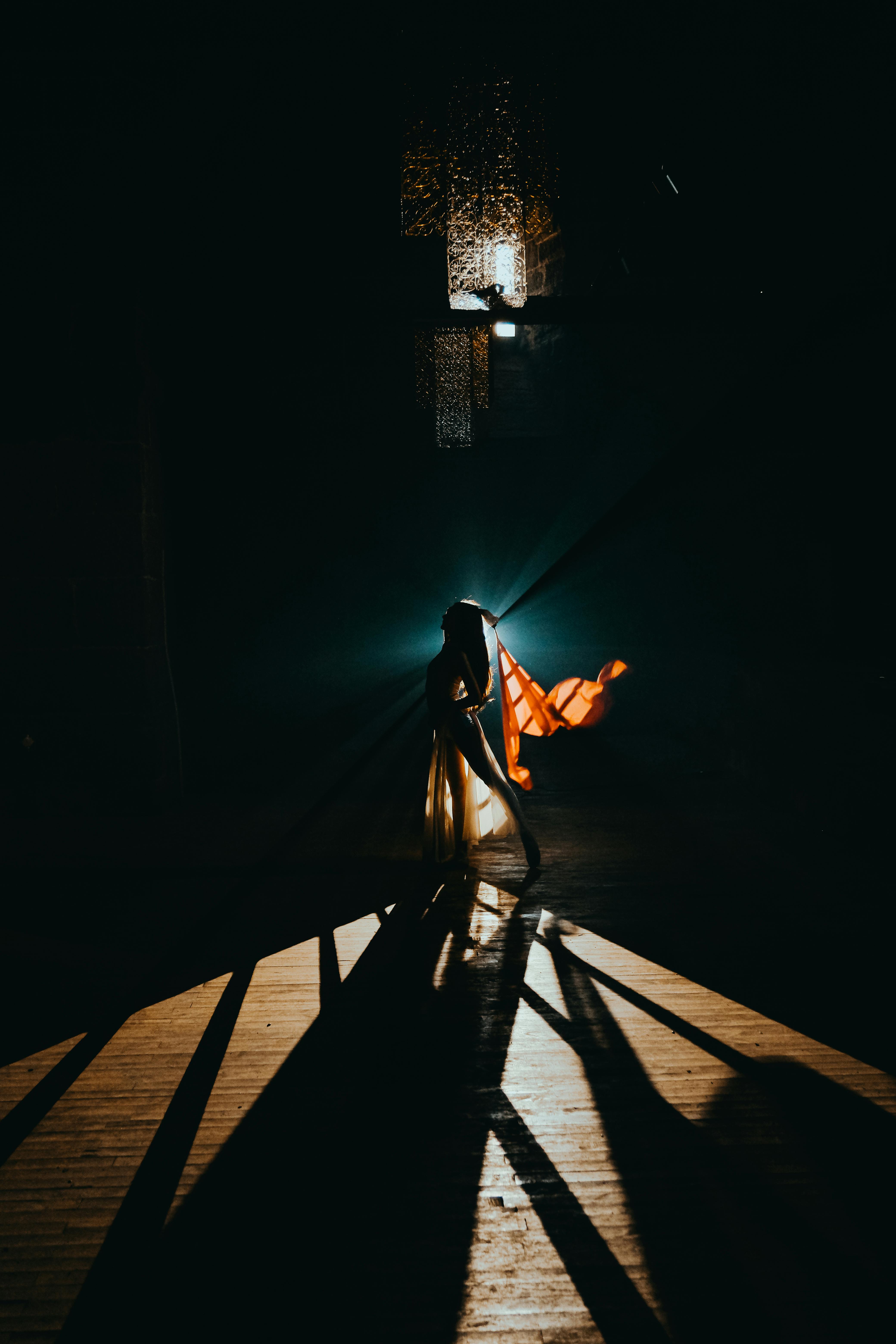 Woman Standing in Shadow · Free Stock Photo