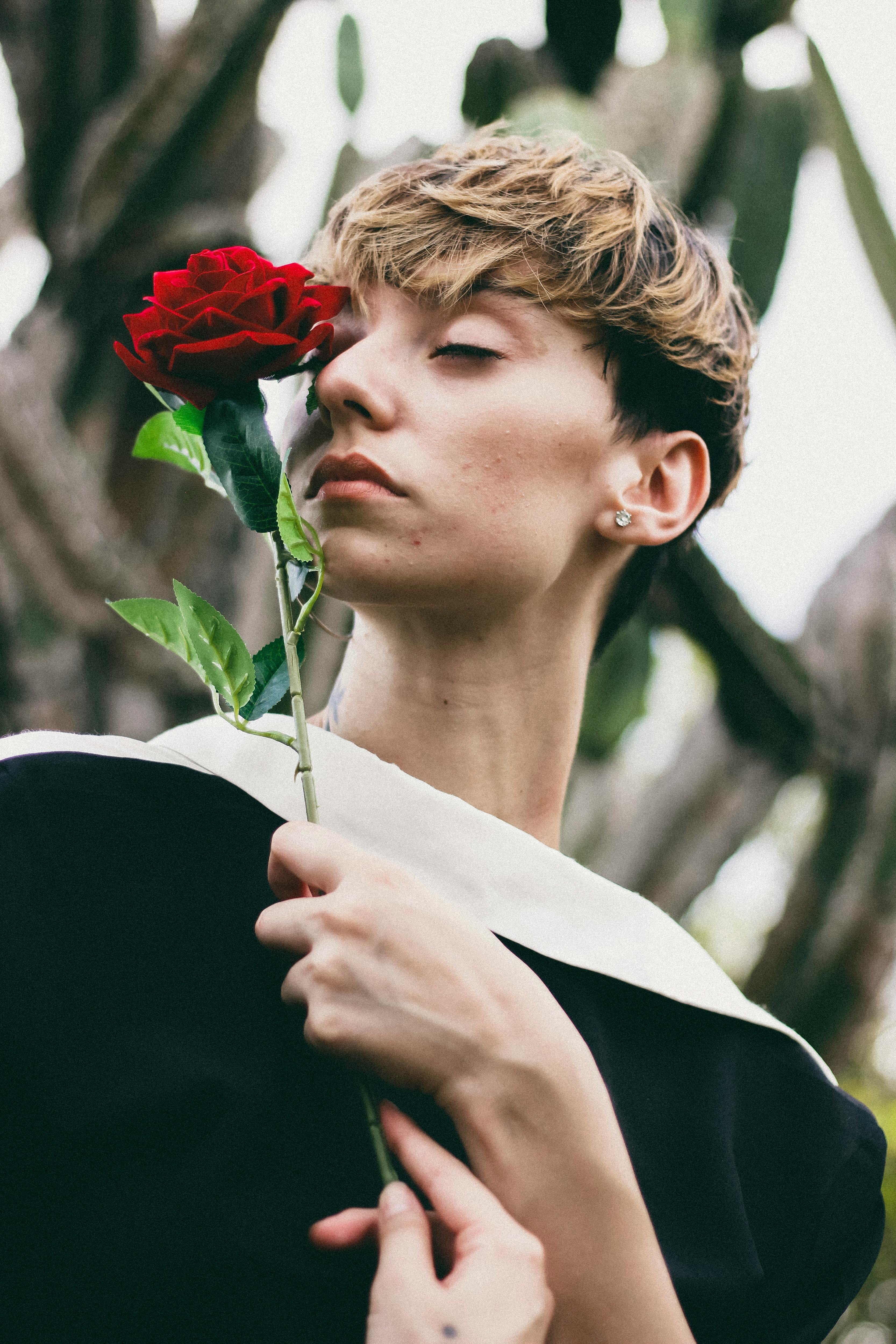 Man Smelling Red Rose · Free Stock Photo