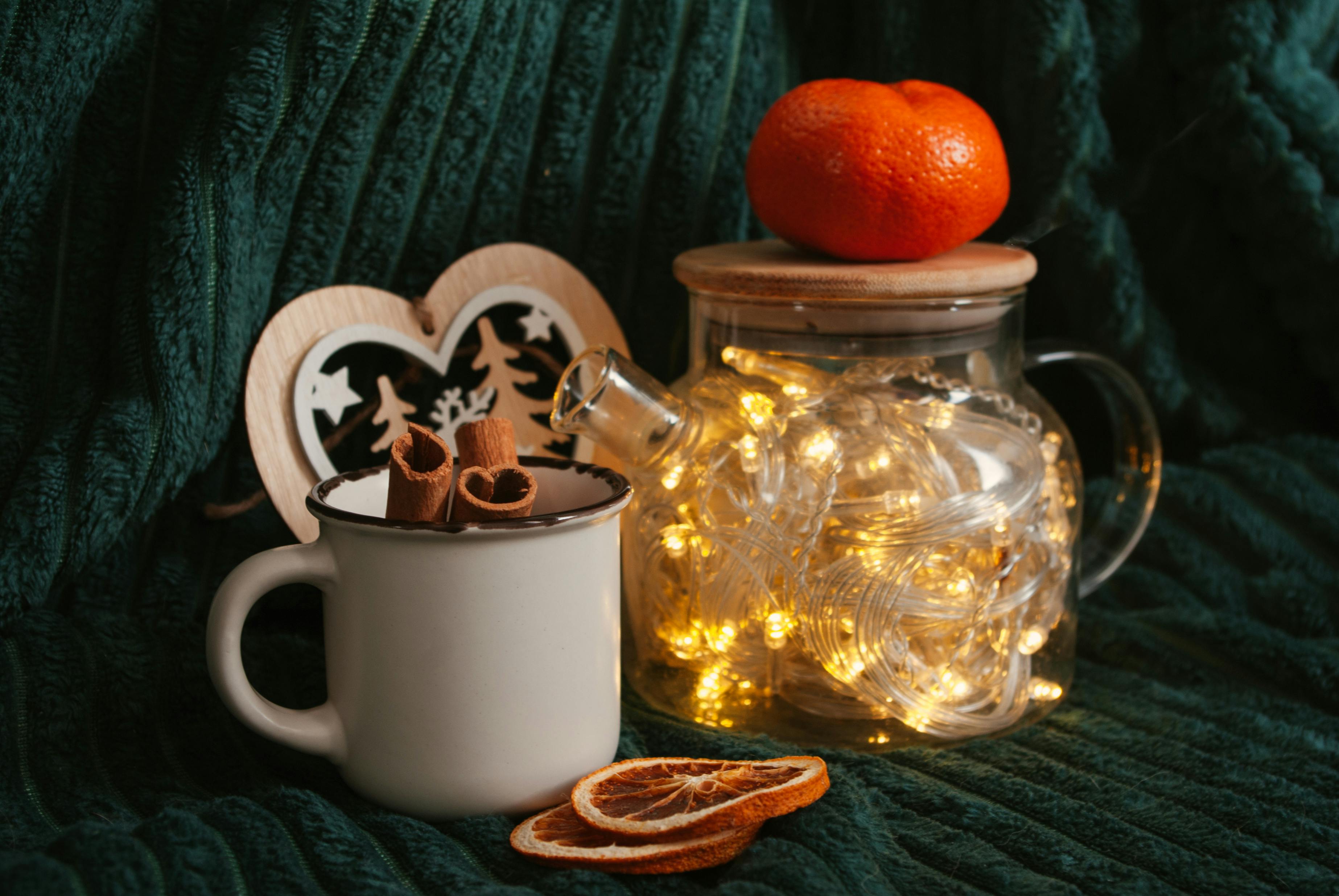 Winter Still Life with Cinnamon, Orange, Persimmon, Fairy Lights and an ...