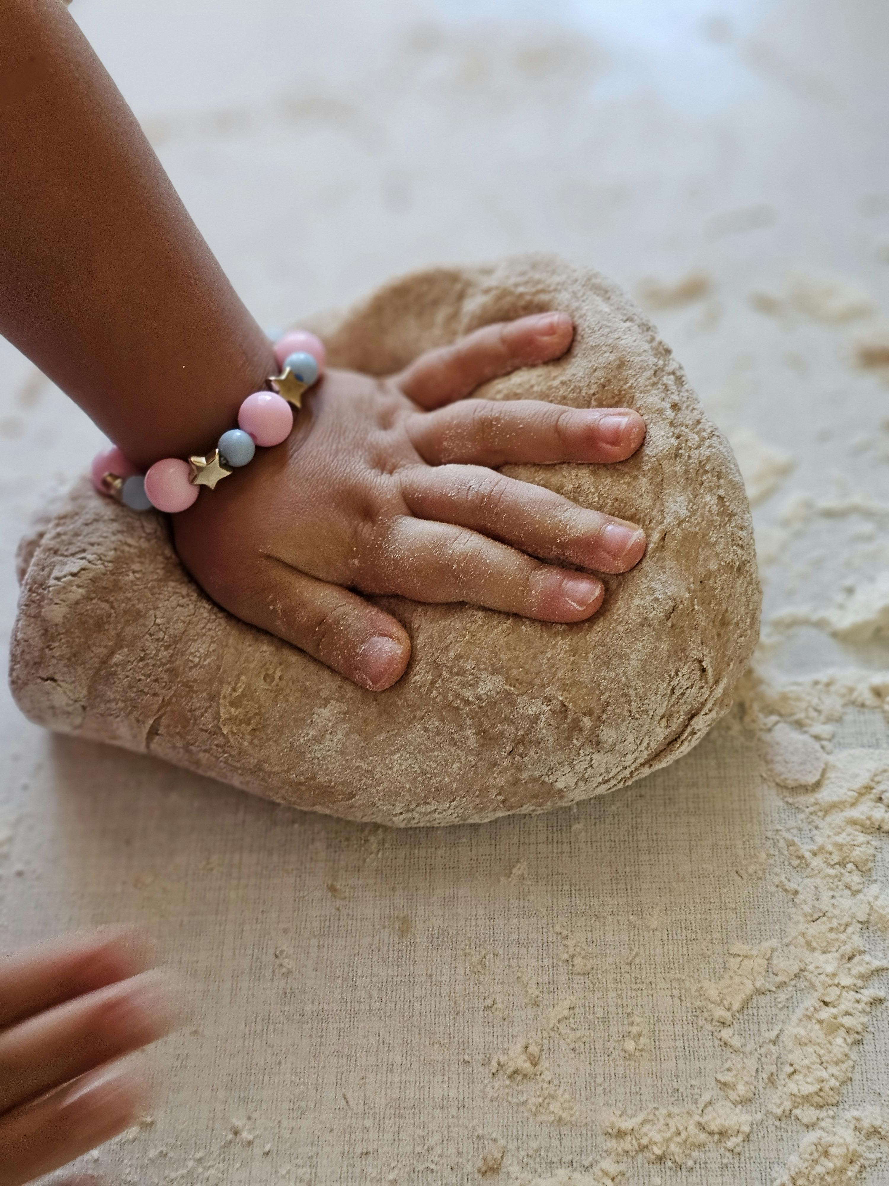 Child Hand Pressing Dough · Free Stock Photo