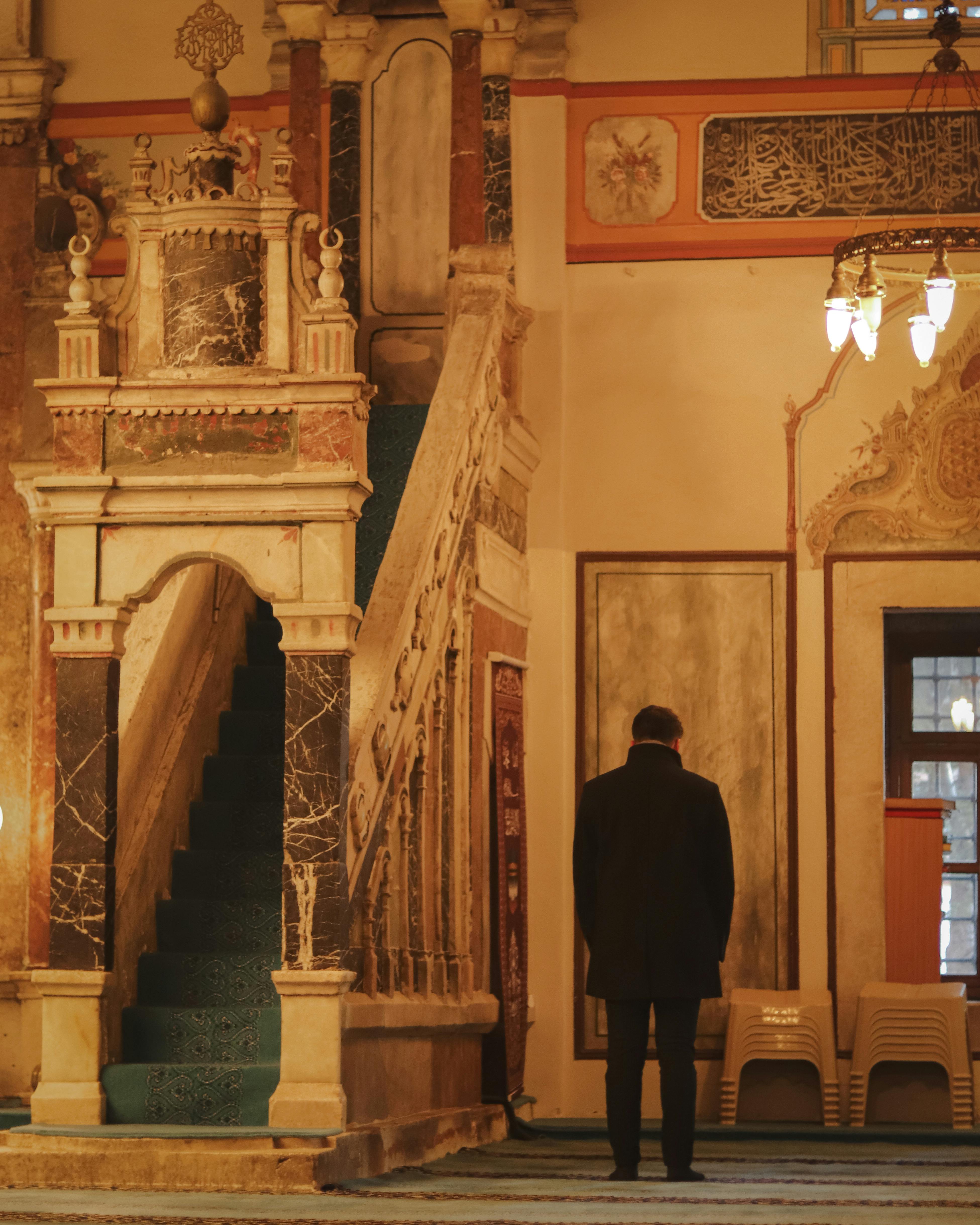 Man Standing in the Mosque · Free Stock Photo