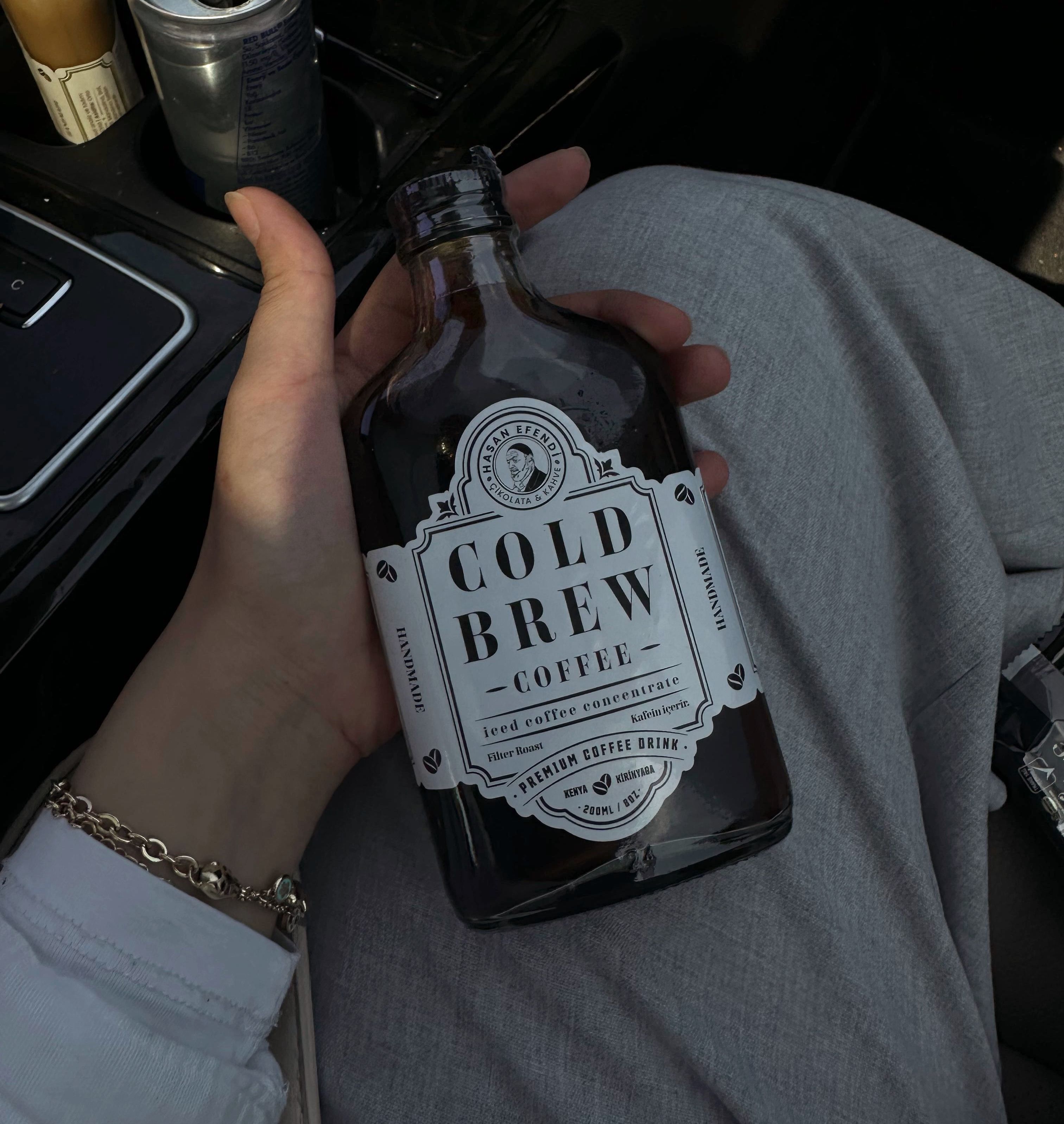 Hand Holding Bottle of Gold Bre Coffee · Free Stock Photo