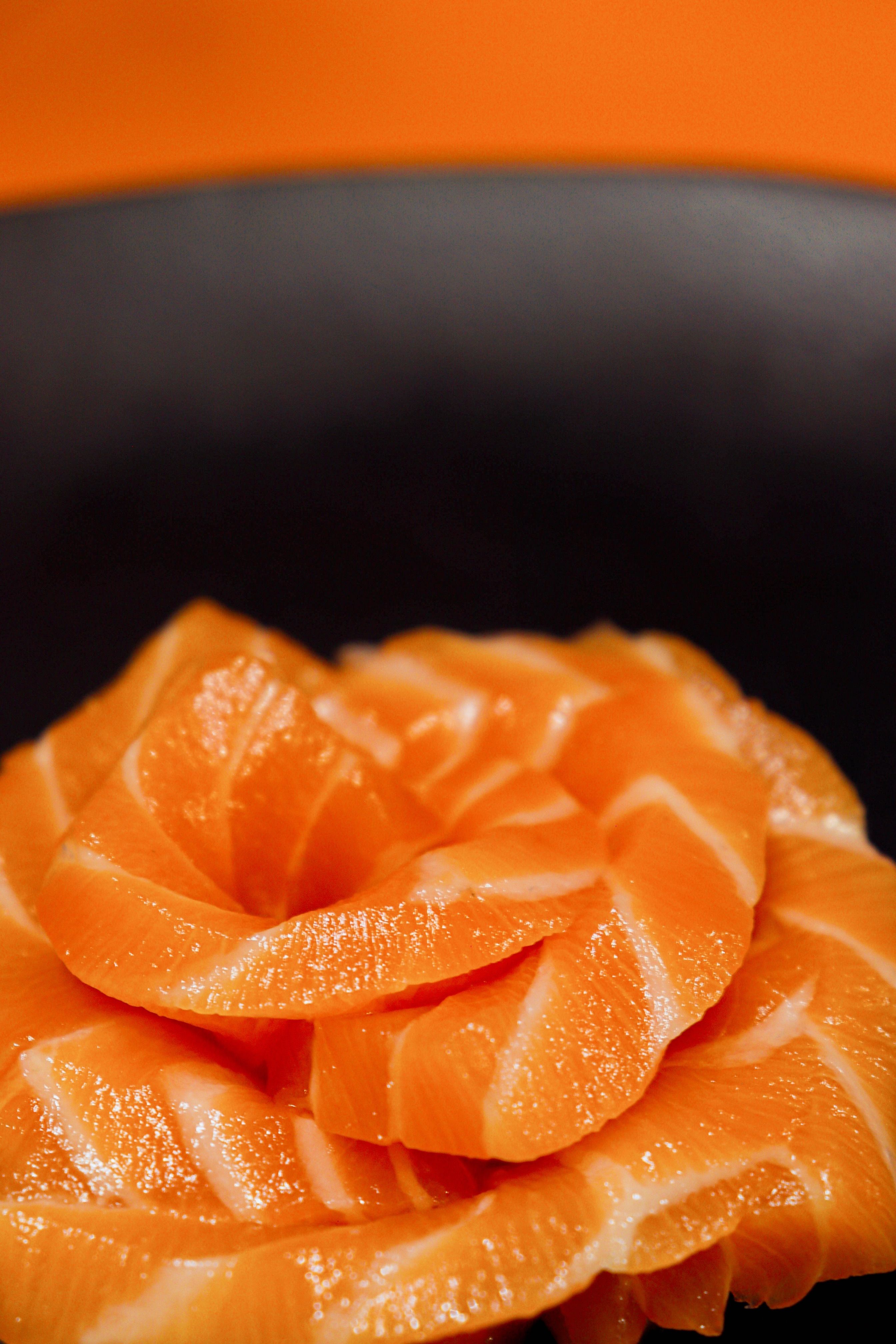 Photo of a Chef with Eyeglasses Slicing Sashimi · Free Stock Photo