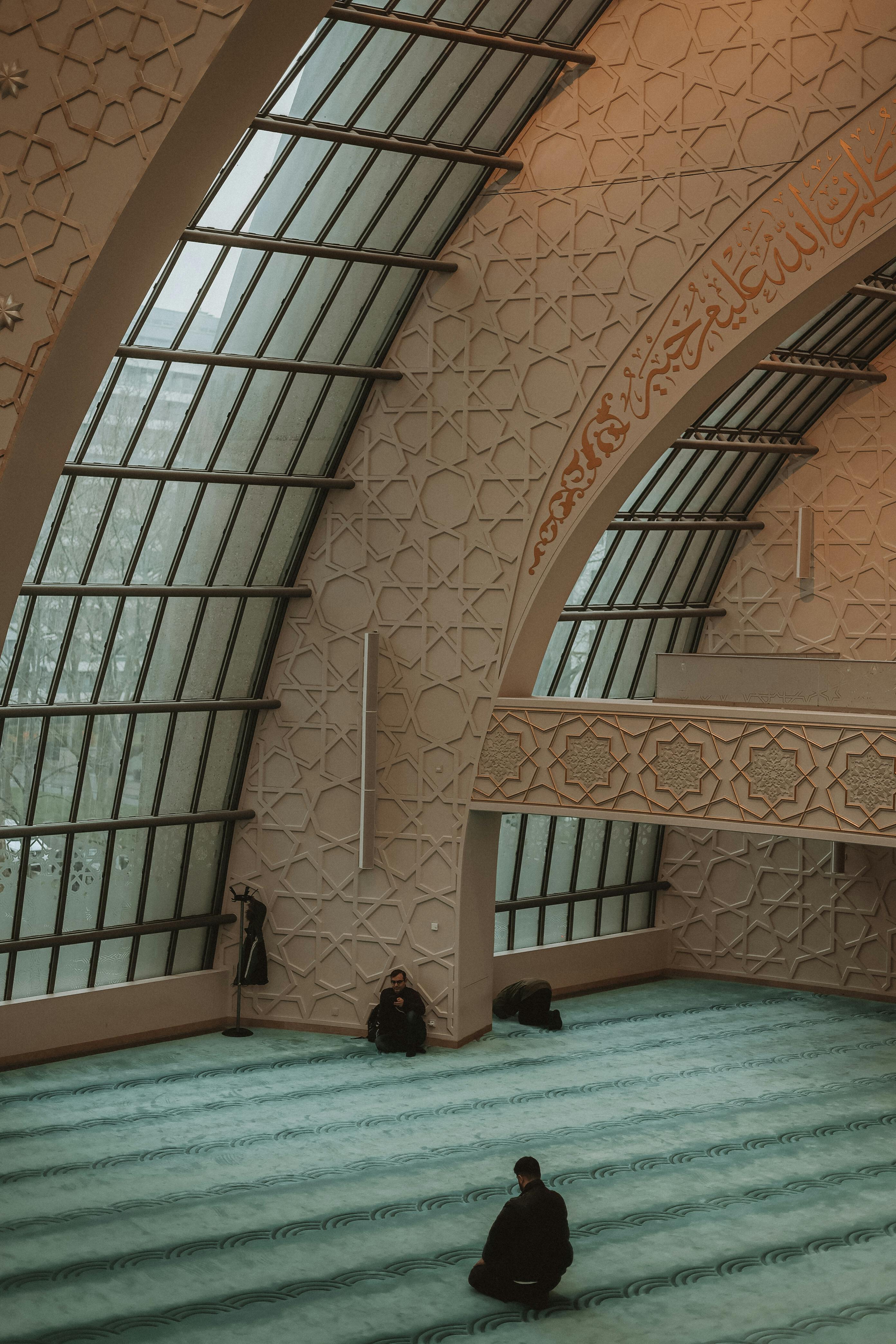 Men Sitting and Praying at Central Mosque in Cologne · Free Stock Photo