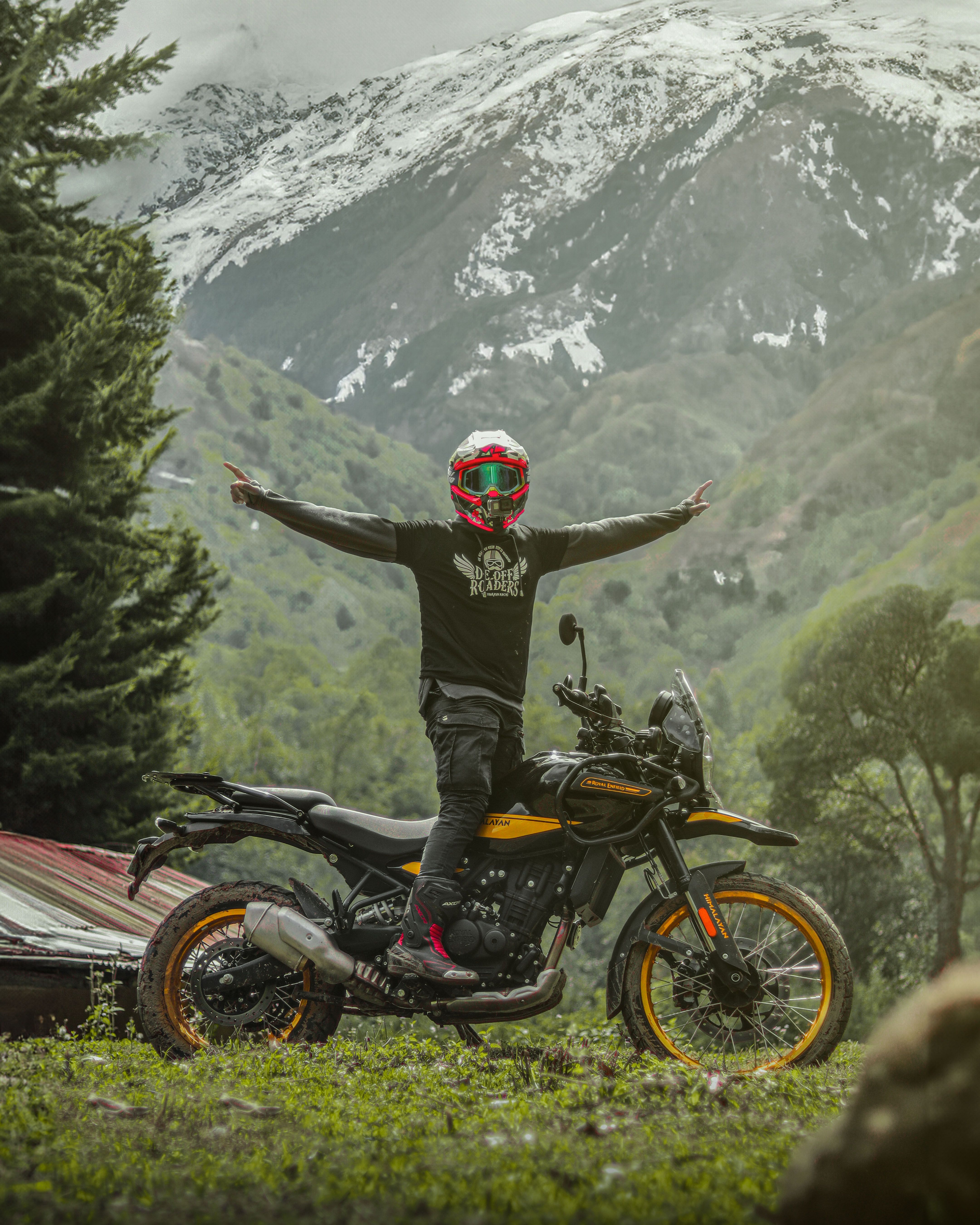 Man in a Helmet Standing on a Motorcycle with Arms Spread · Free Stock ...