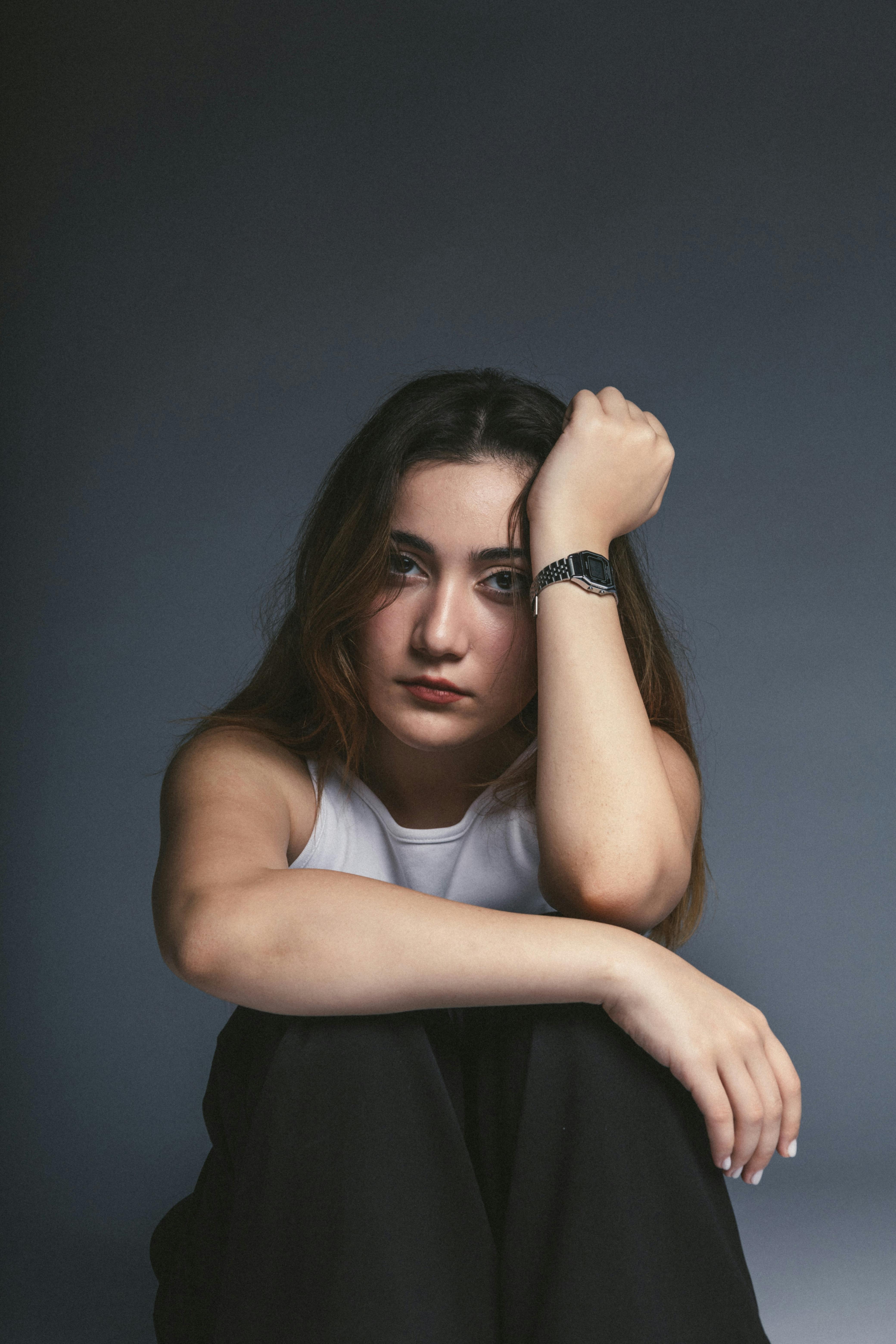 Woman Staring at the Camera with a Tired Look · Free Stock Photo