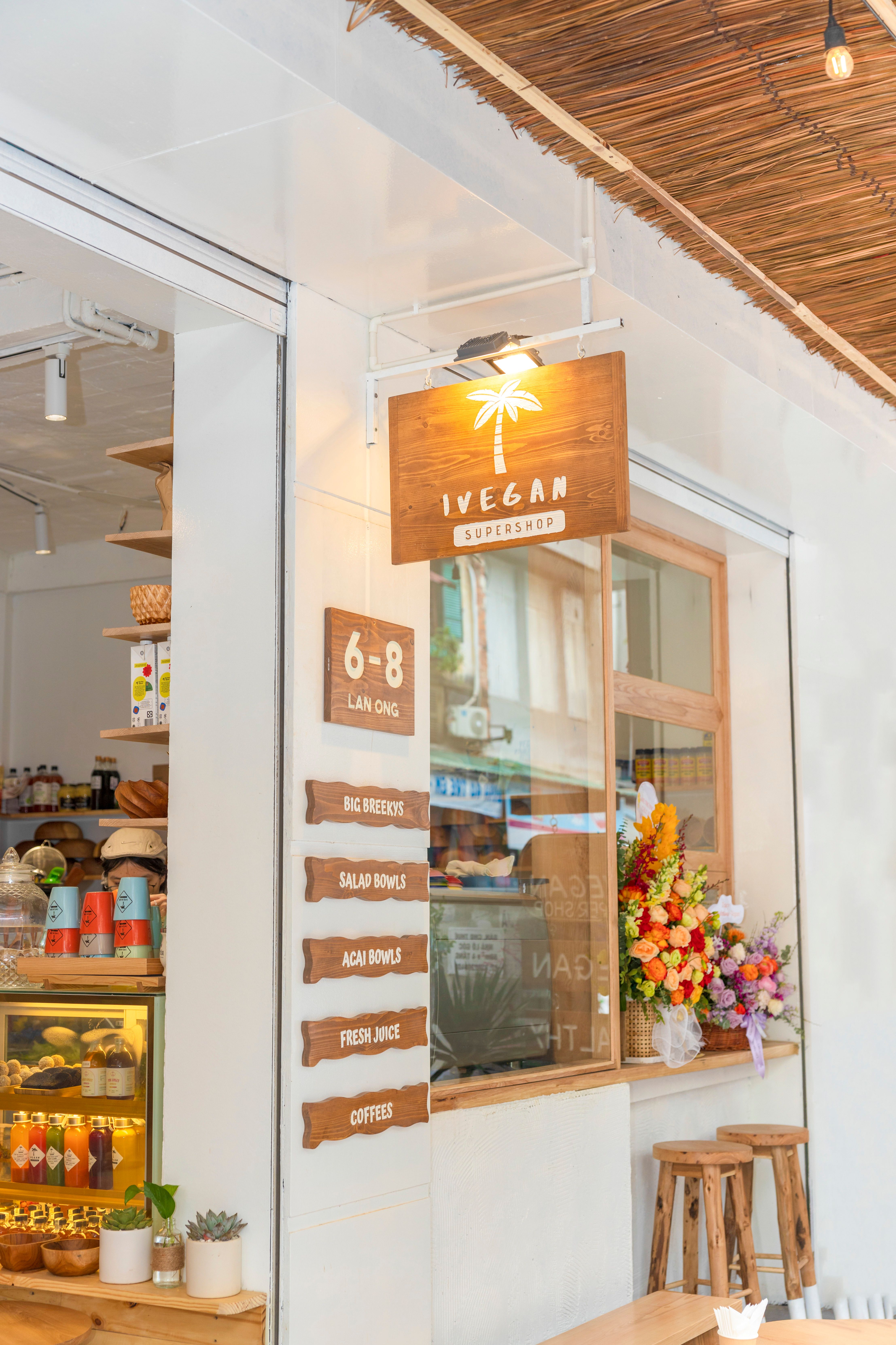 Restaurant Wooden Sign by Entrance to Building · Free Stock Photo