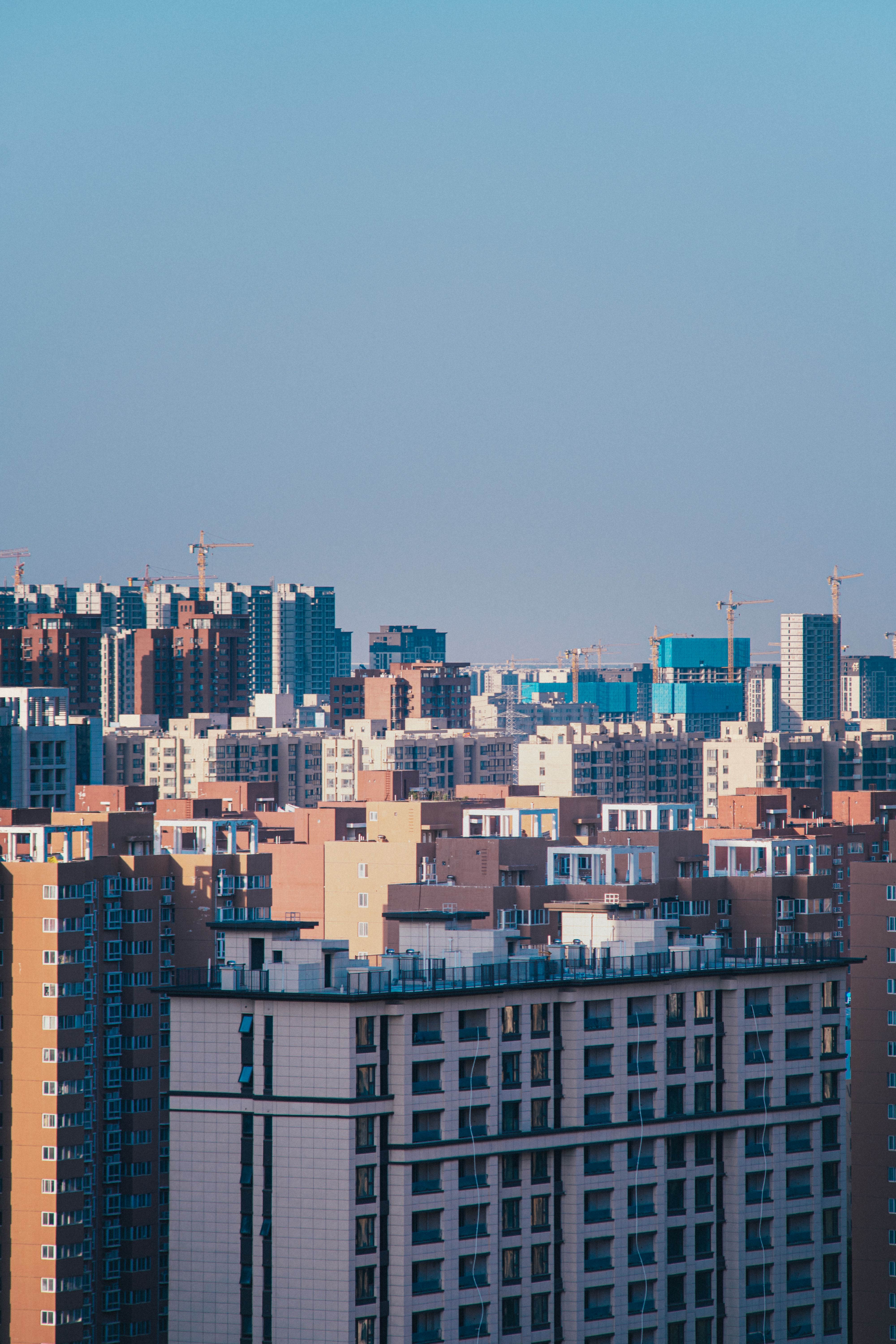 View of Modern Blocks of Flats in City under Blue Sky · Free Stock Photo